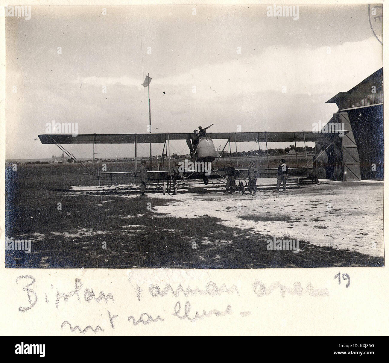 The image shows a biplane by M. Farman equipped with a machine gun ...