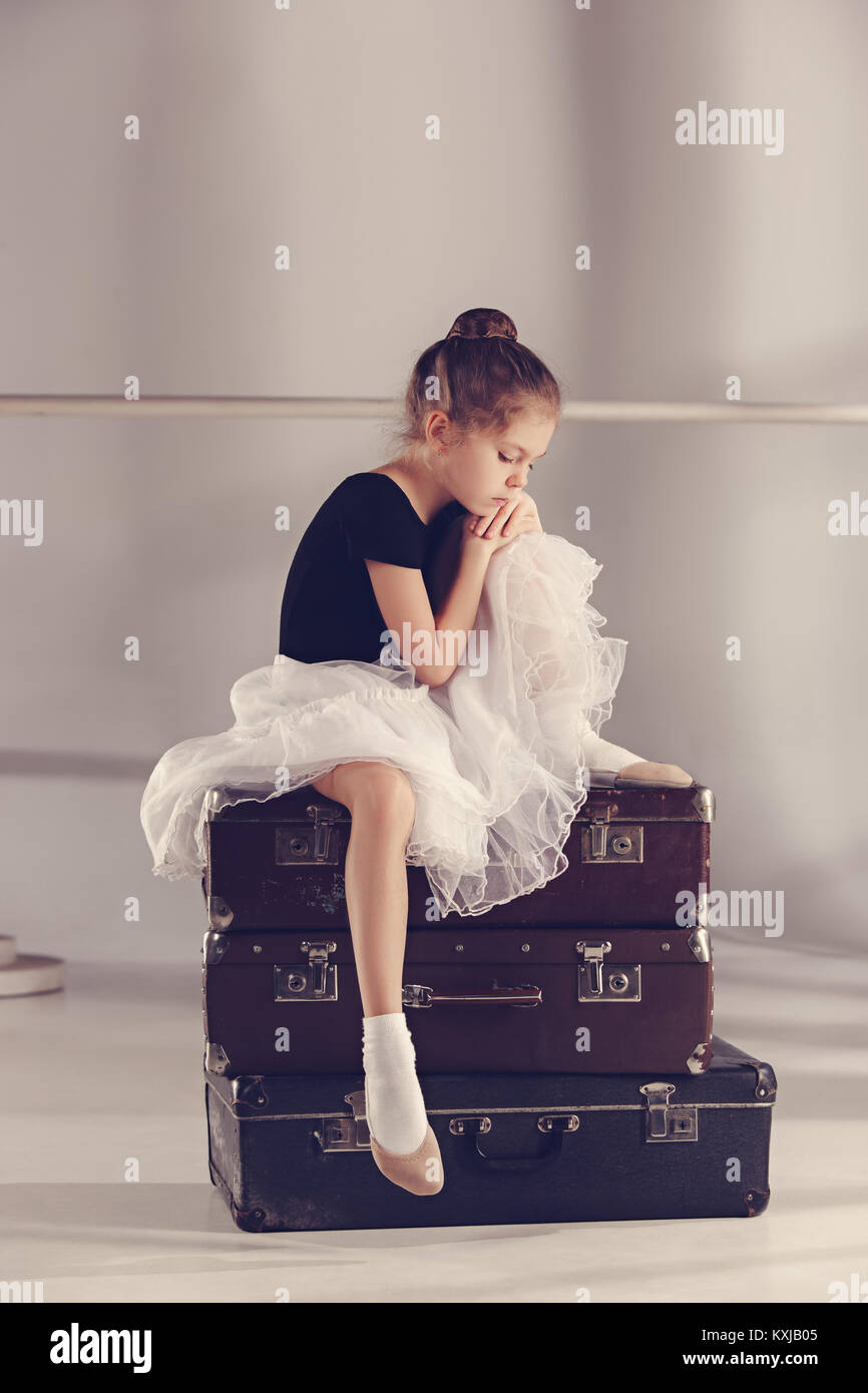 The little girl as balerina dancer sitting at studio Stock Photo - Alamy