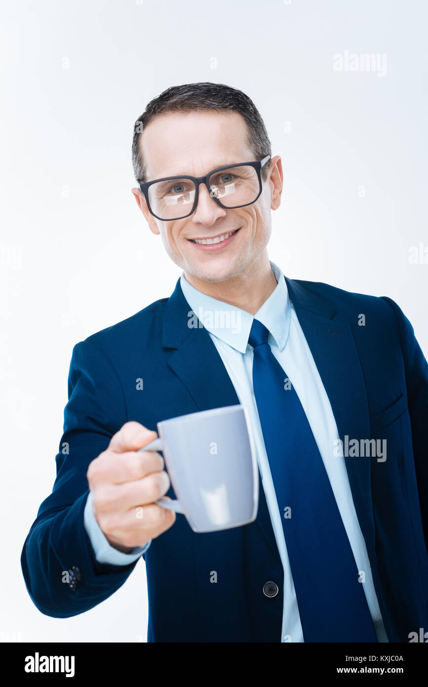 Business man offering coffee hi-res stock photography and images - Alamy