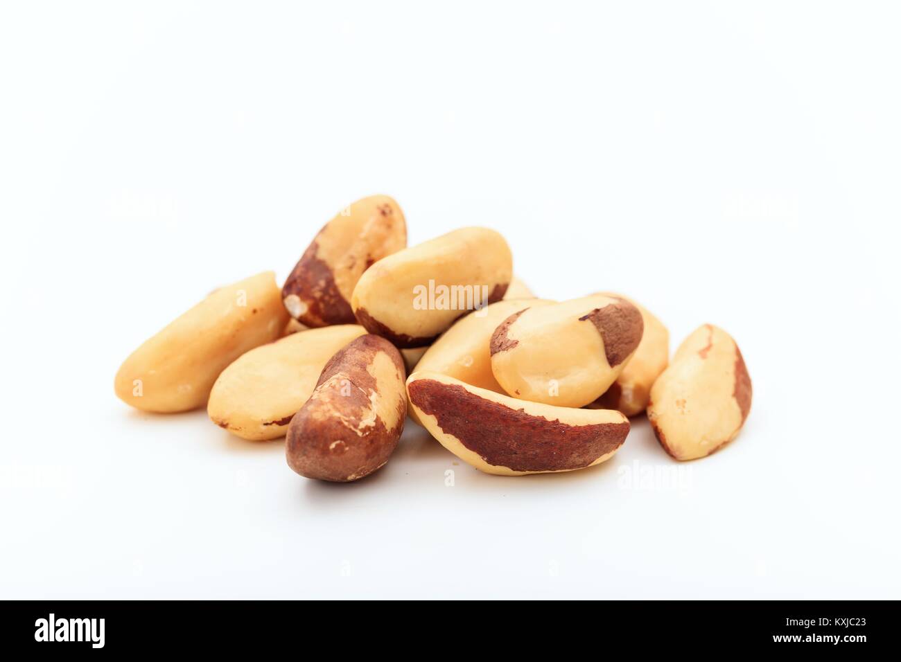 Brazil nuts on white background Stock Photo - Alamy