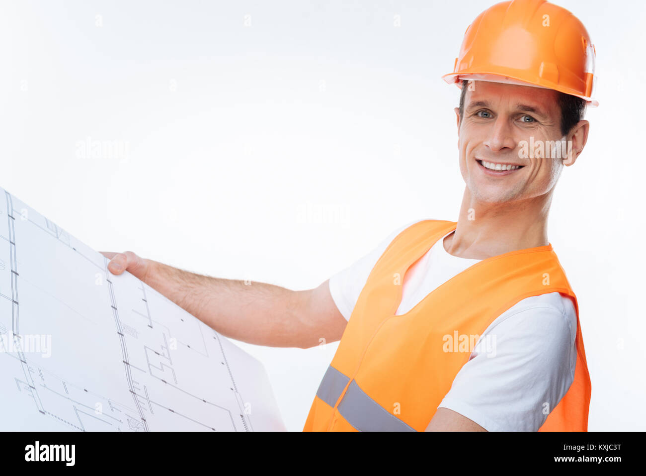 Smart confident engineer holding his draft Stock Photo - Alamy