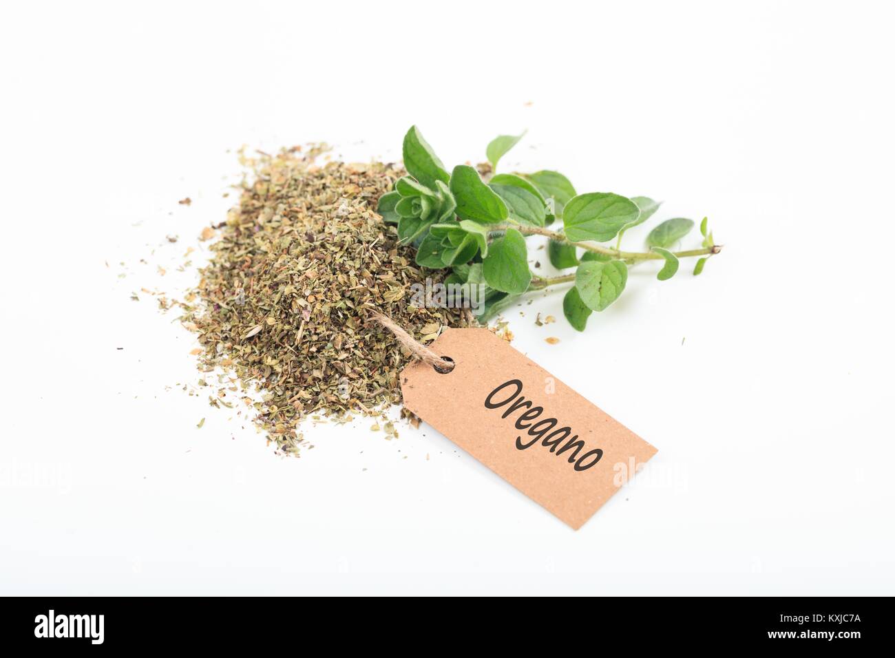 Oregano fresh and dried with label on white background Stock Photo - Alamy