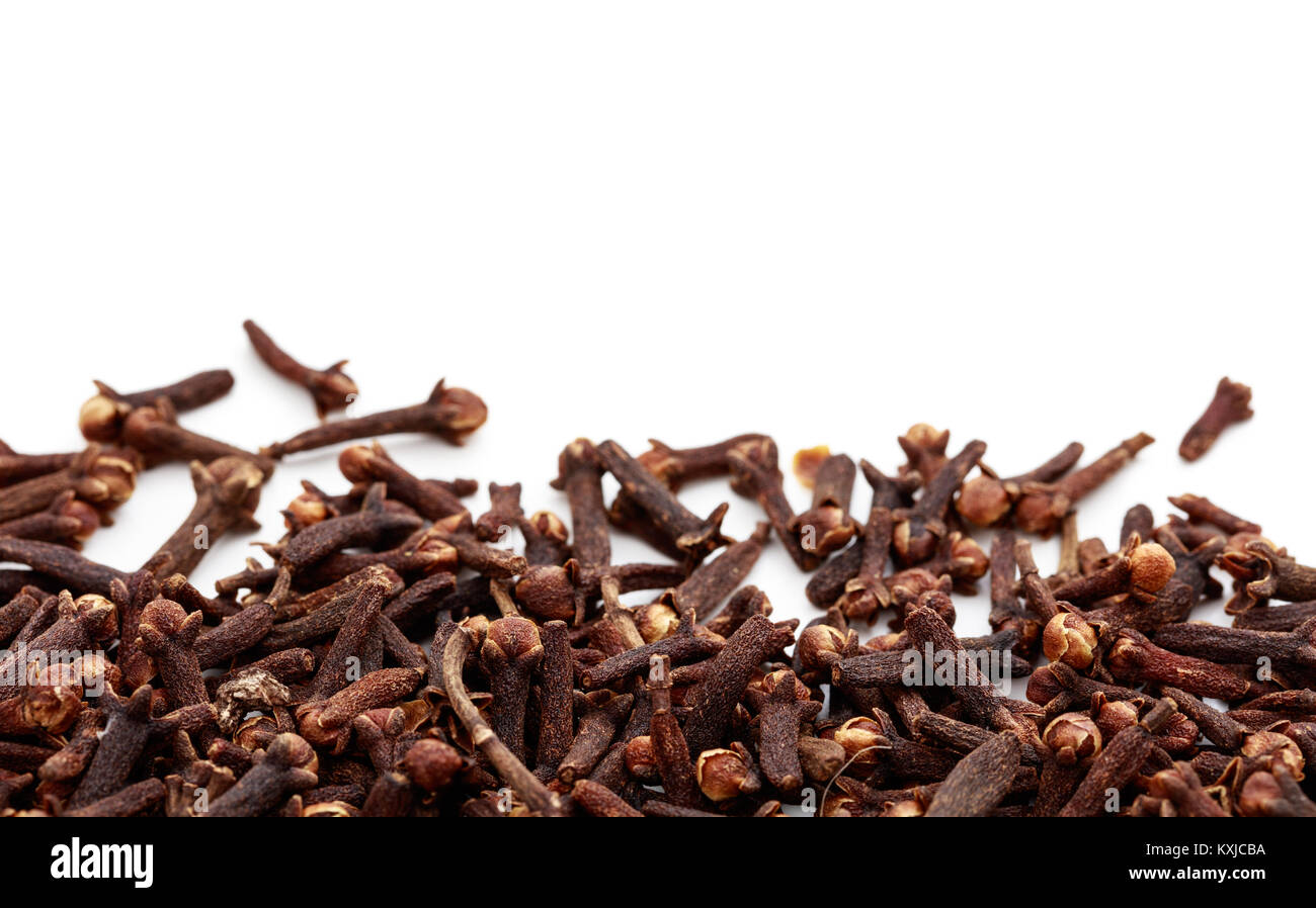 Clove seeds on white background Stock Photo - Alamy