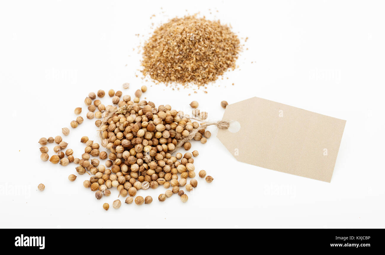Coriander seeds on white background Stock Photo - Alamy