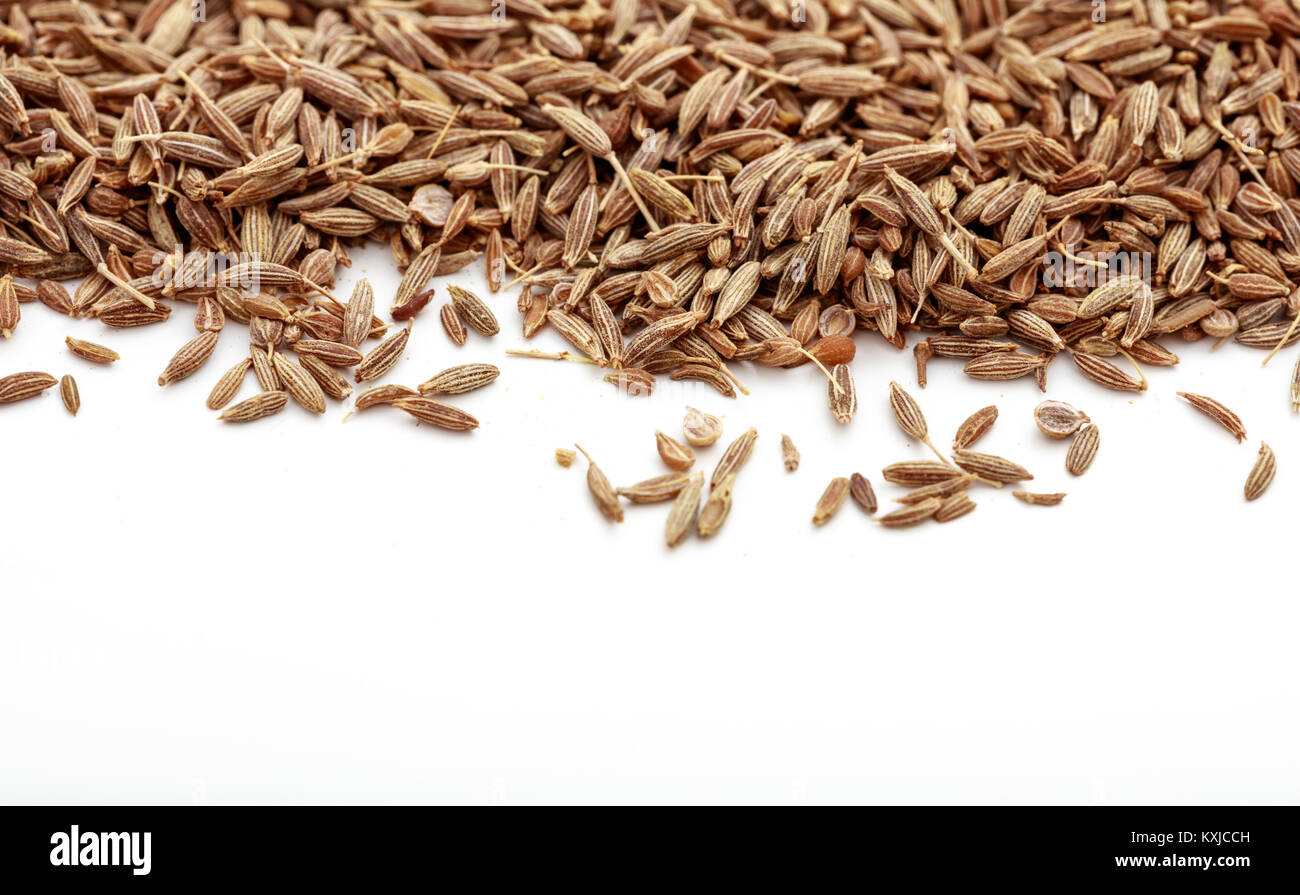 Cumin seeds on white background Stock Photo - Alamy