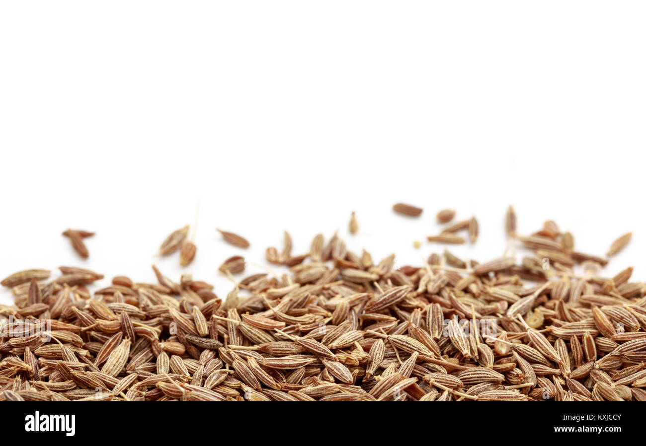 Cumin seeds on white background Stock Photo - Alamy