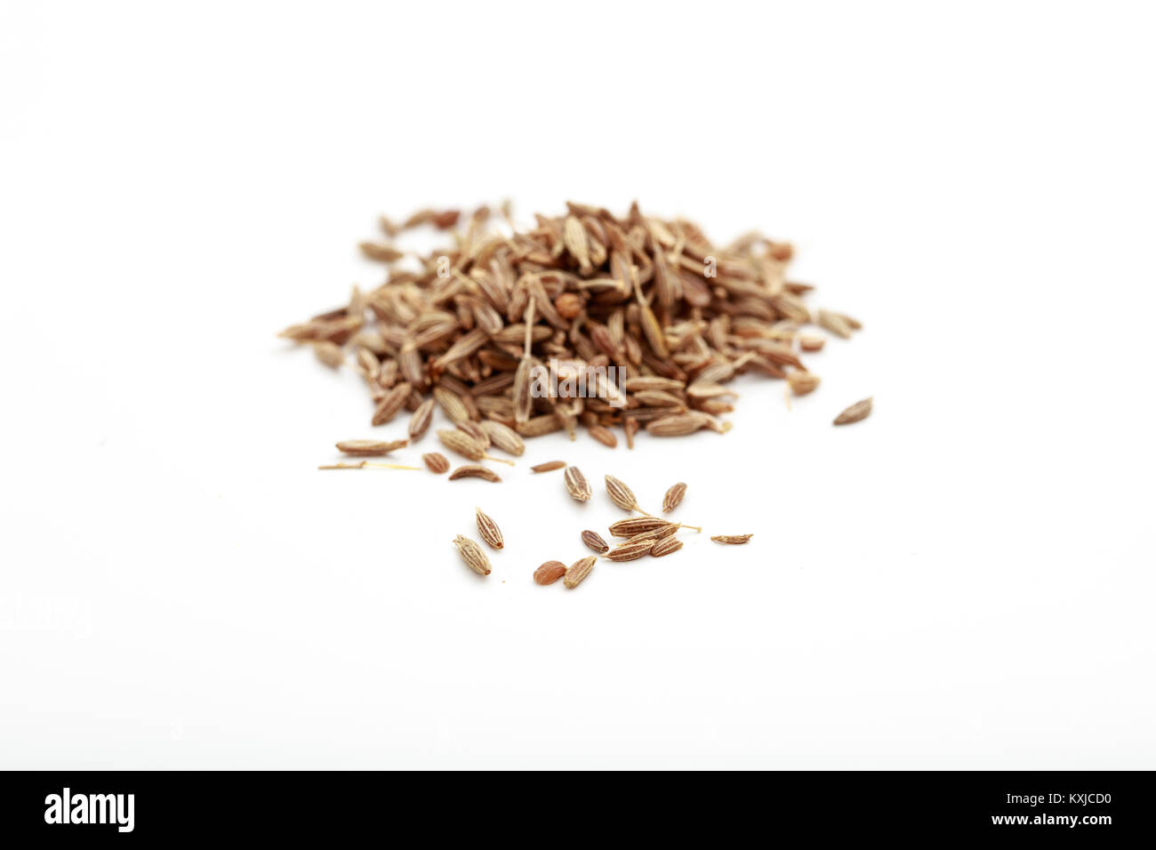 Cumin seeds on white background Stock Photo - Alamy