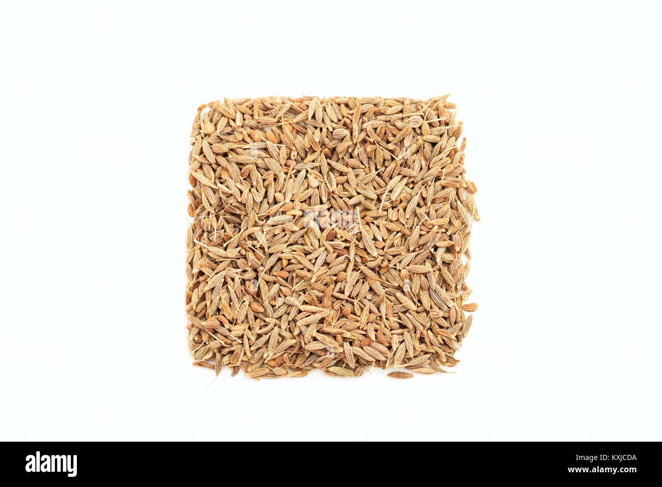Cumin seeds on white background Stock Photo - Alamy