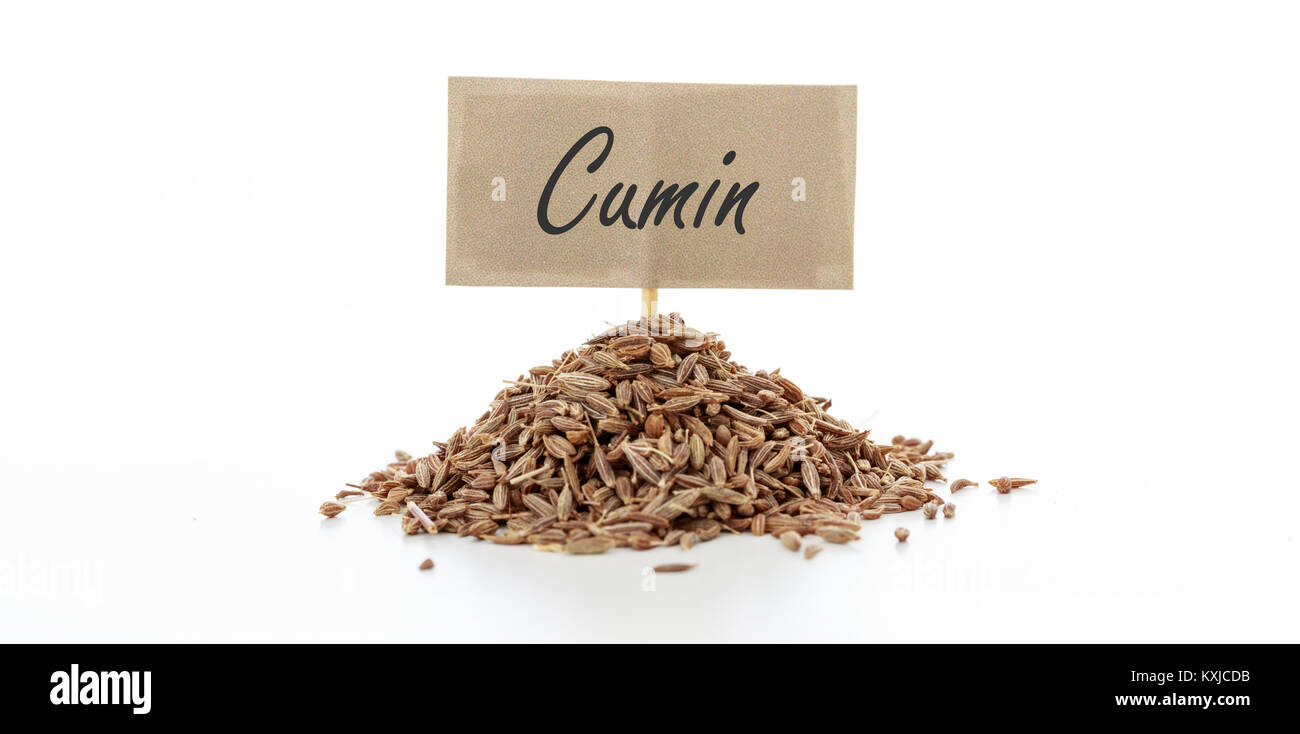 Cumin seeds on white background Stock Photo - Alamy