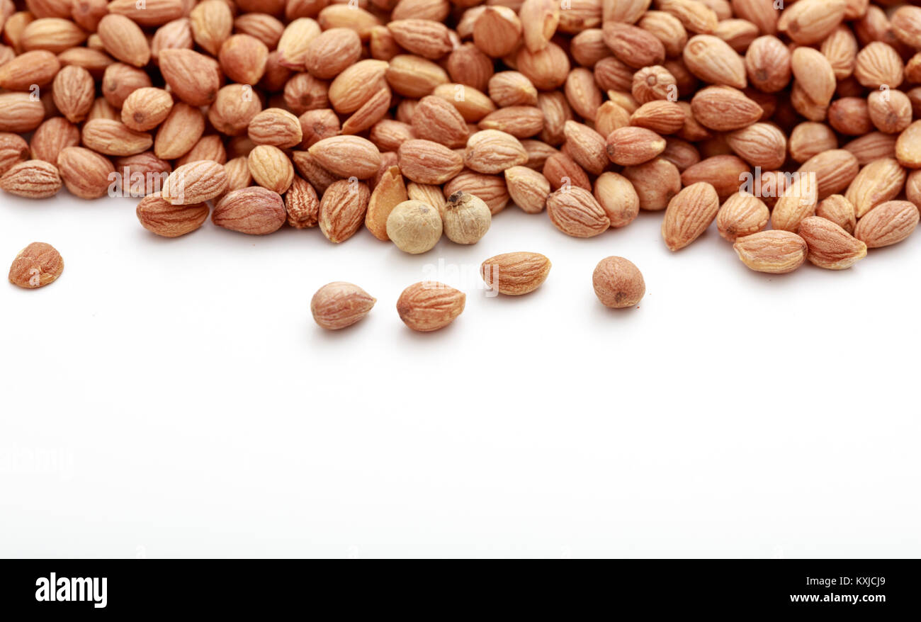 Mahlab seeds on white background with copy space Stock Photo - Alamy