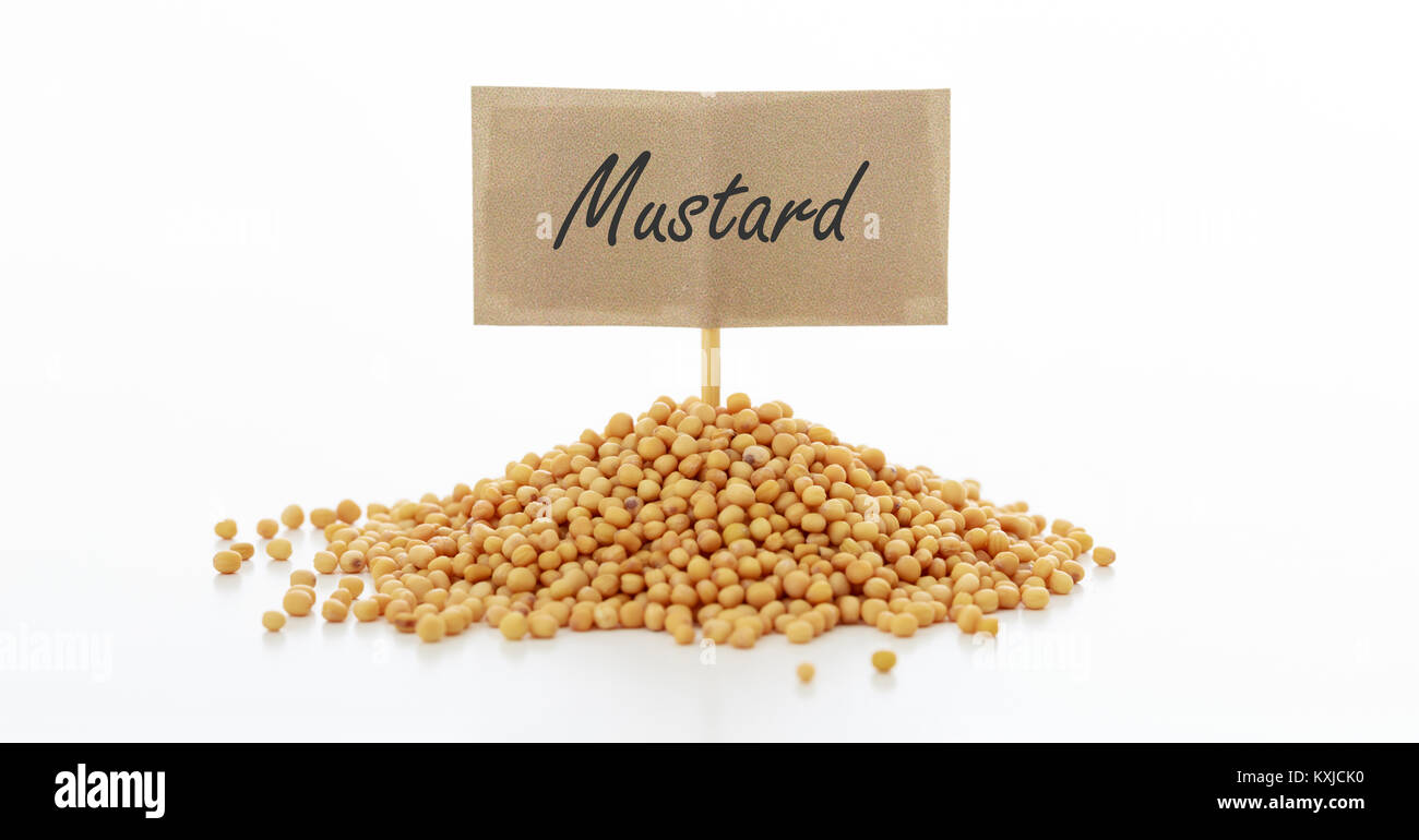 Mustard seeds with a label, on a white background Stock Photo - Alamy