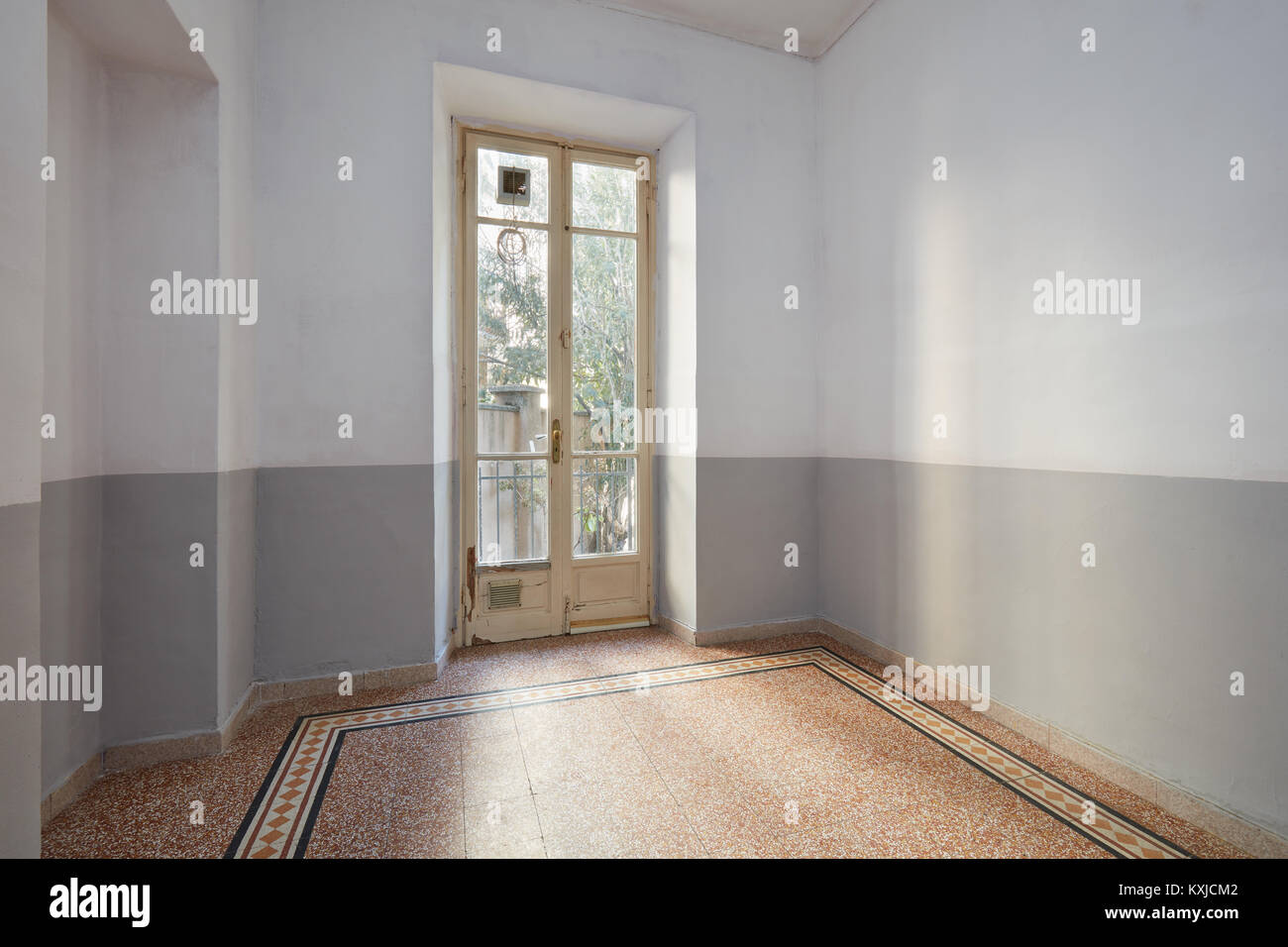 Empty room interior with tiled floor and old window with balcony Stock ...