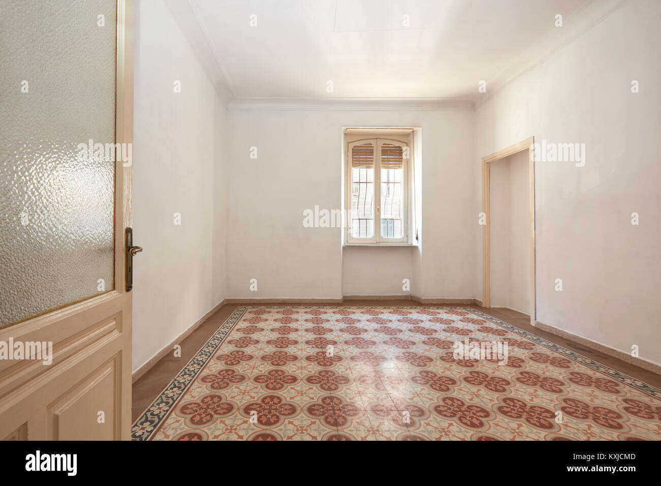 Large empty room interior with old geometric tiled floor Stock Photo ...