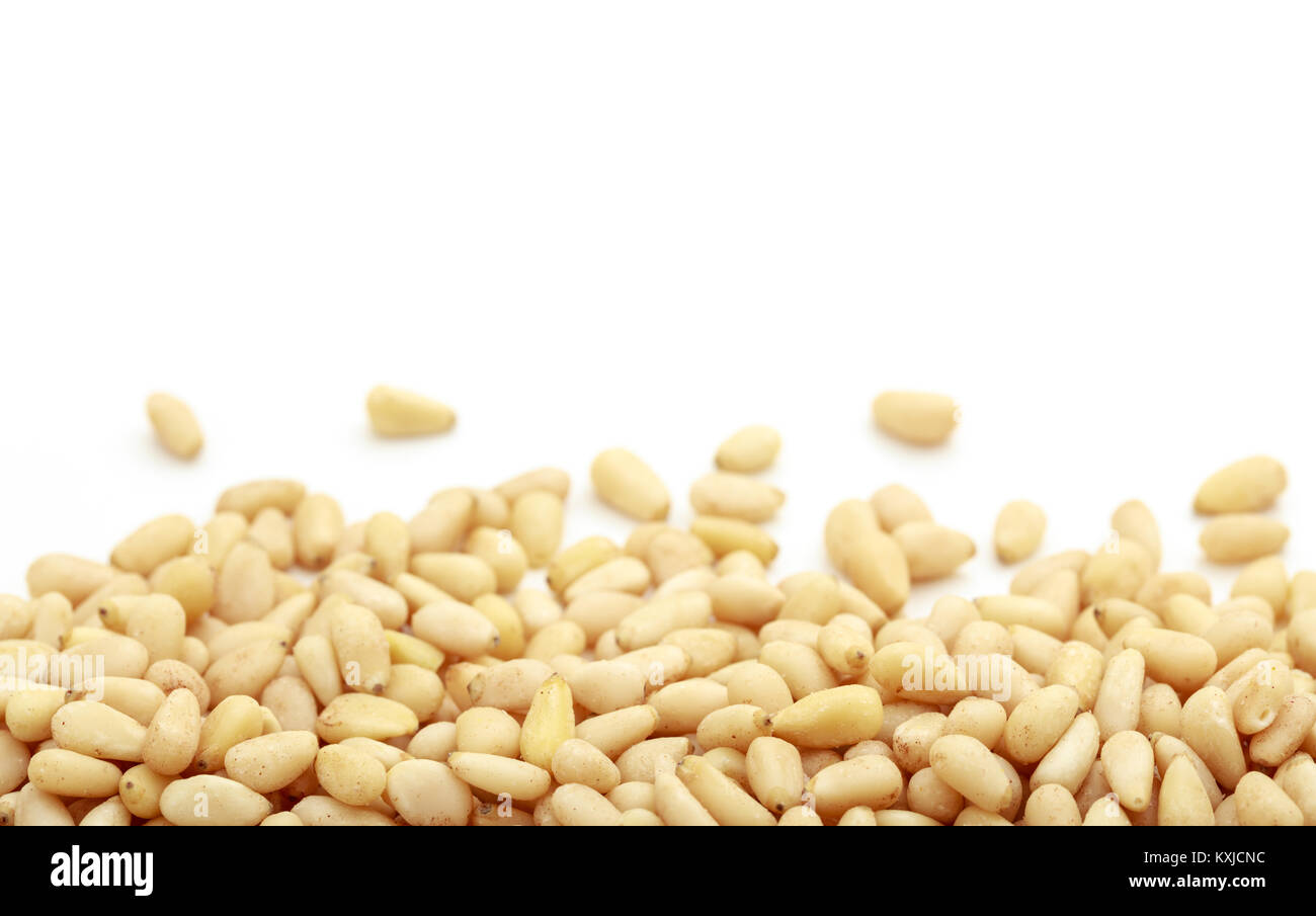 Pine seeds on white background Stock Photo - Alamy