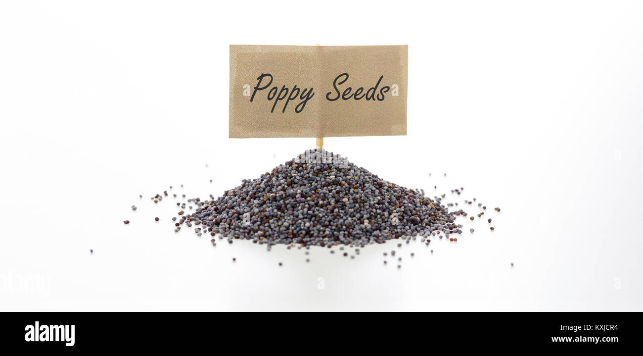 Black poppy seeds with label on white background Stock Photo - Alamy