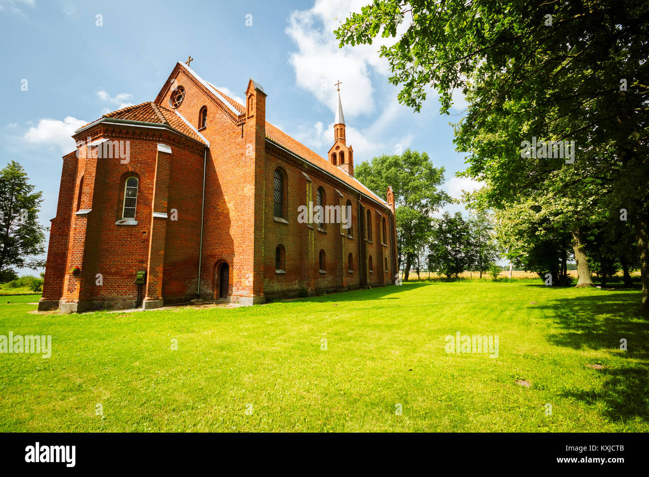 Small gothic style church on a green grass in Lithuania Stock Photo - Alamy