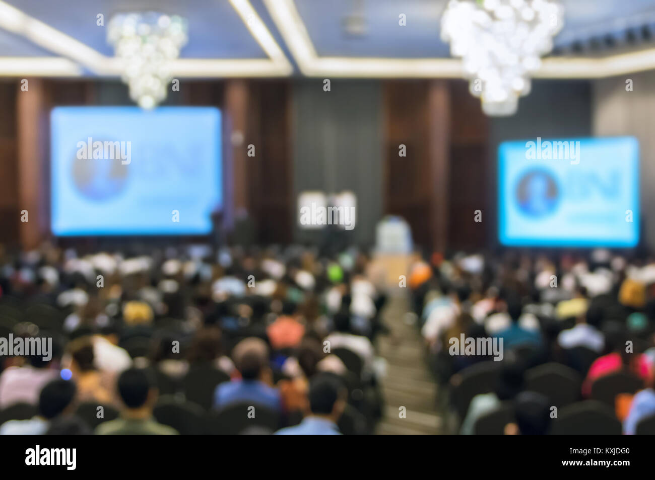 Abstract blurred photo of conference hall or seminar room with attendee ...