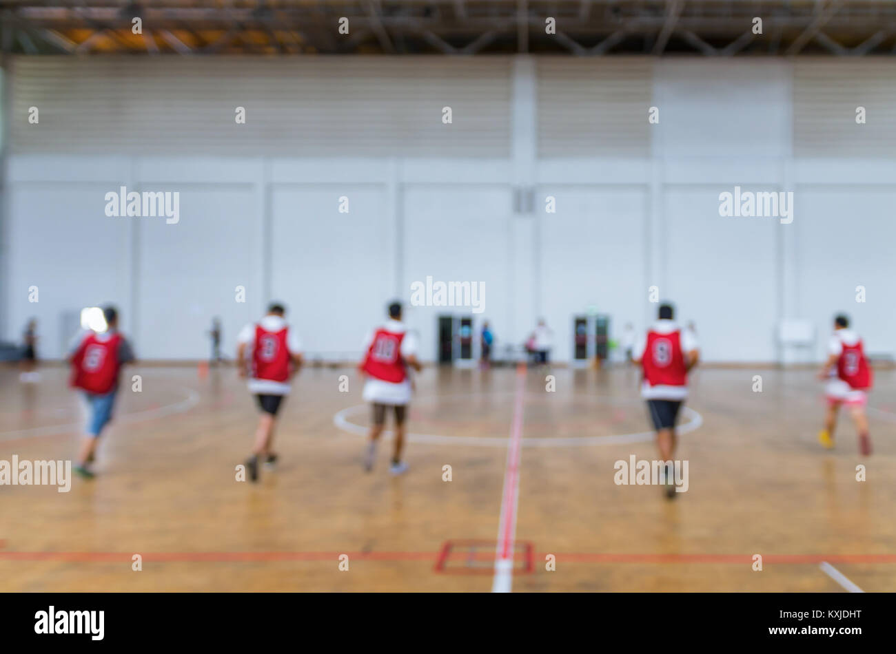 Abstract blurred photo of athletes run in Basketball court background ...