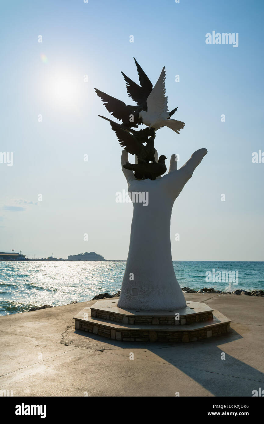 KUSADASI, TURKEY - AUGUST 22, 2017: The hand of peace sculpture with ...