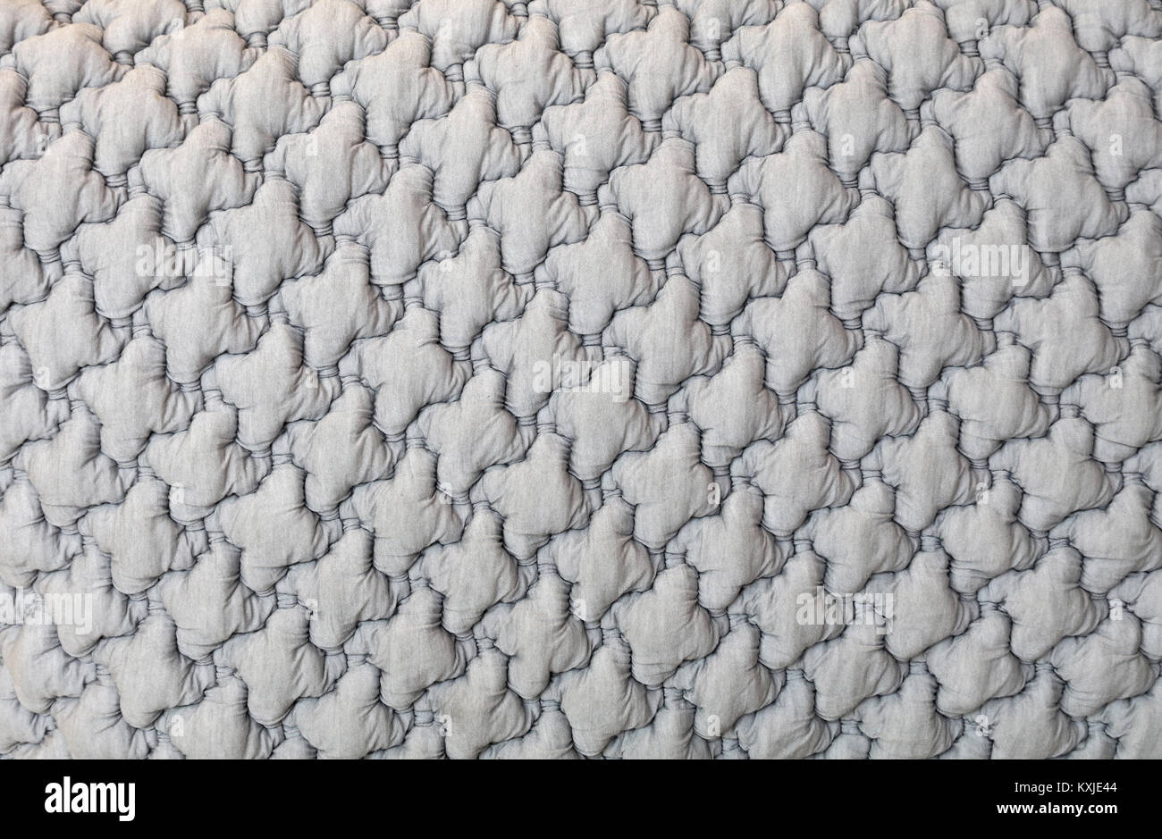Close up background texture of neutral gray soft tufted textile ...