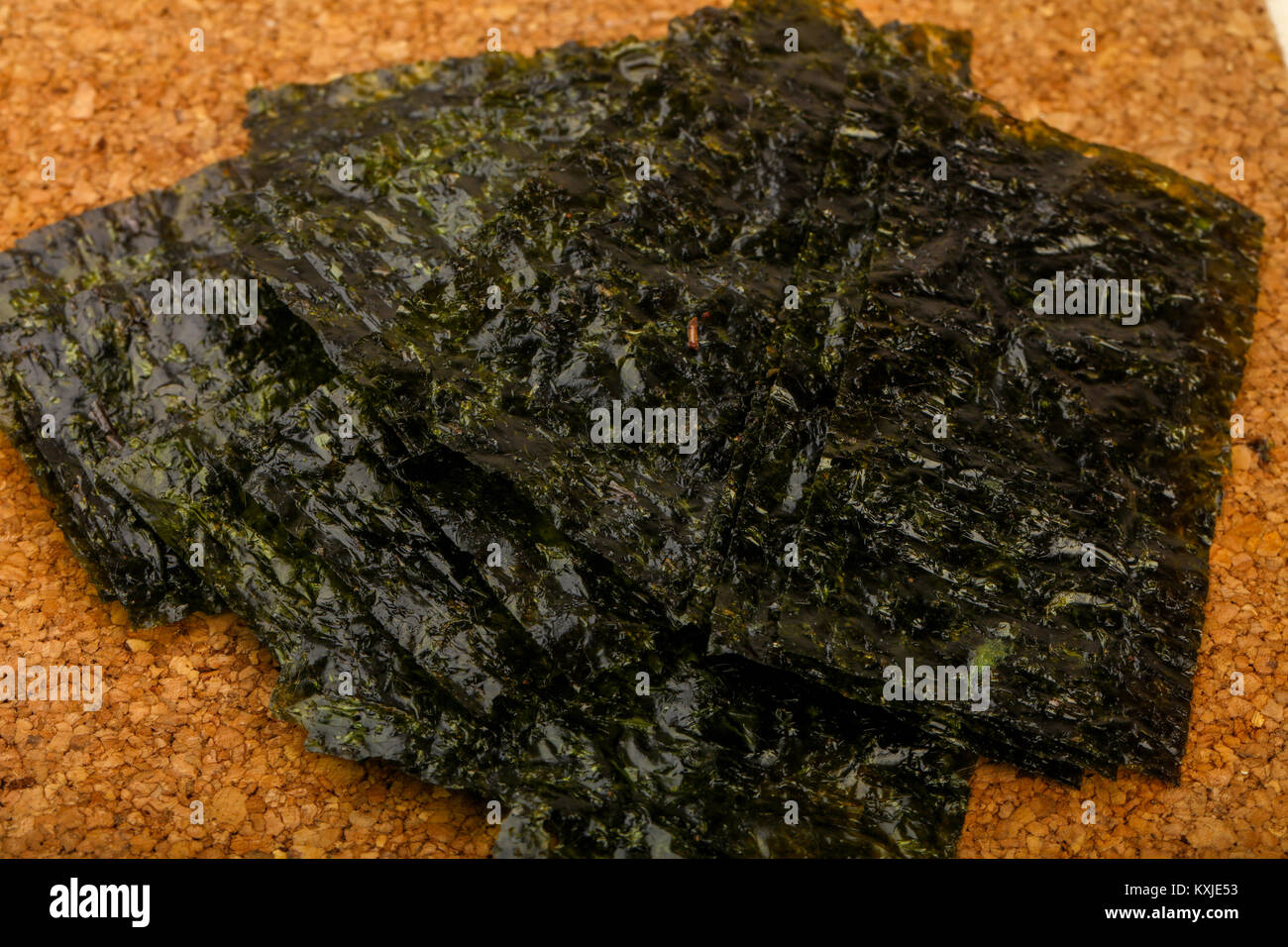 Crispy Nori sheets chips over wooden background Stock Photo - Alamy