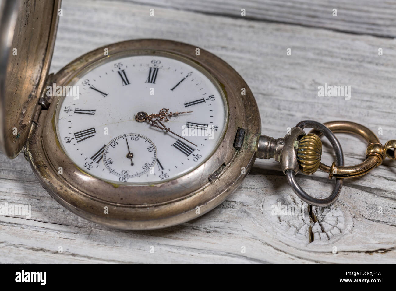 Vintage pocket watch lying on an old rustic wood background Stock Photo ...