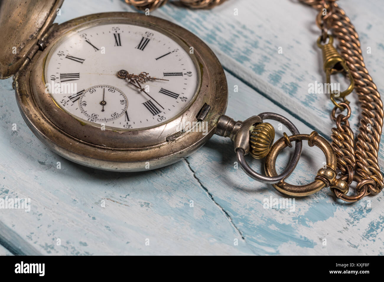 Antique silver pocket watch on wooden table Stock Photo - Alamy