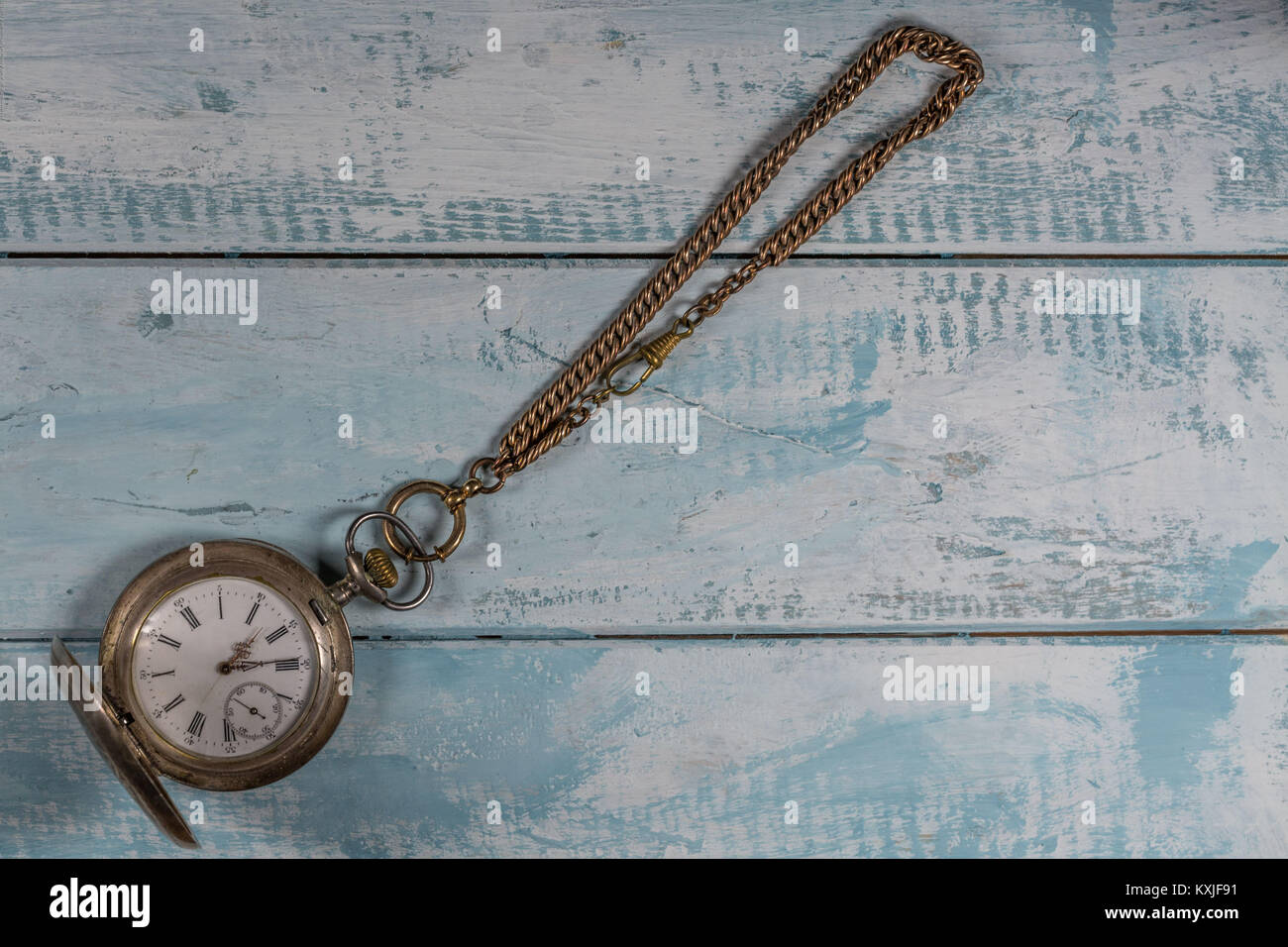 Vintage pocket-watch on the rustic desk Stock Photo - Alamy