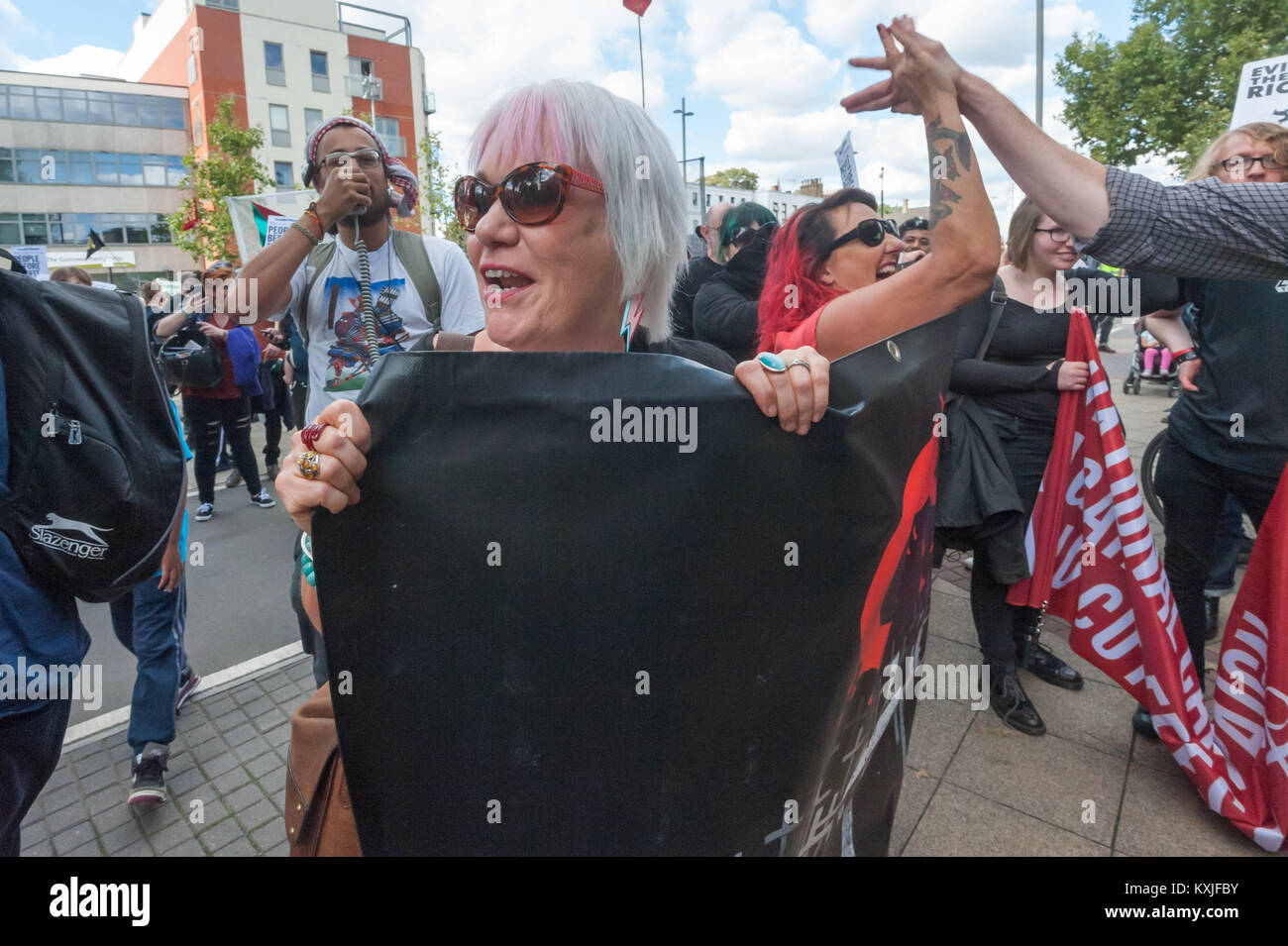 Class War supporters celebrate after their protest inside Foxtons ...