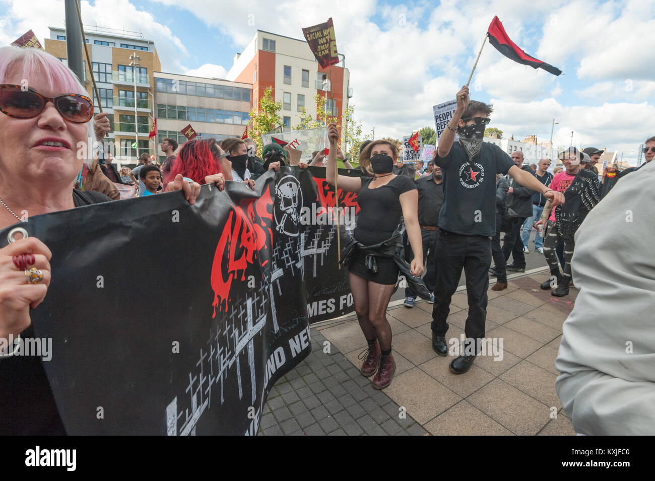 Class War supporters celebrate after their protest inside Foxtons ...