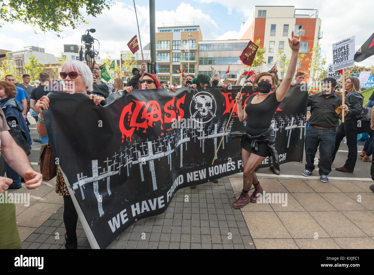 Class War supporters celebrate after their protest inside Foxtons ...
