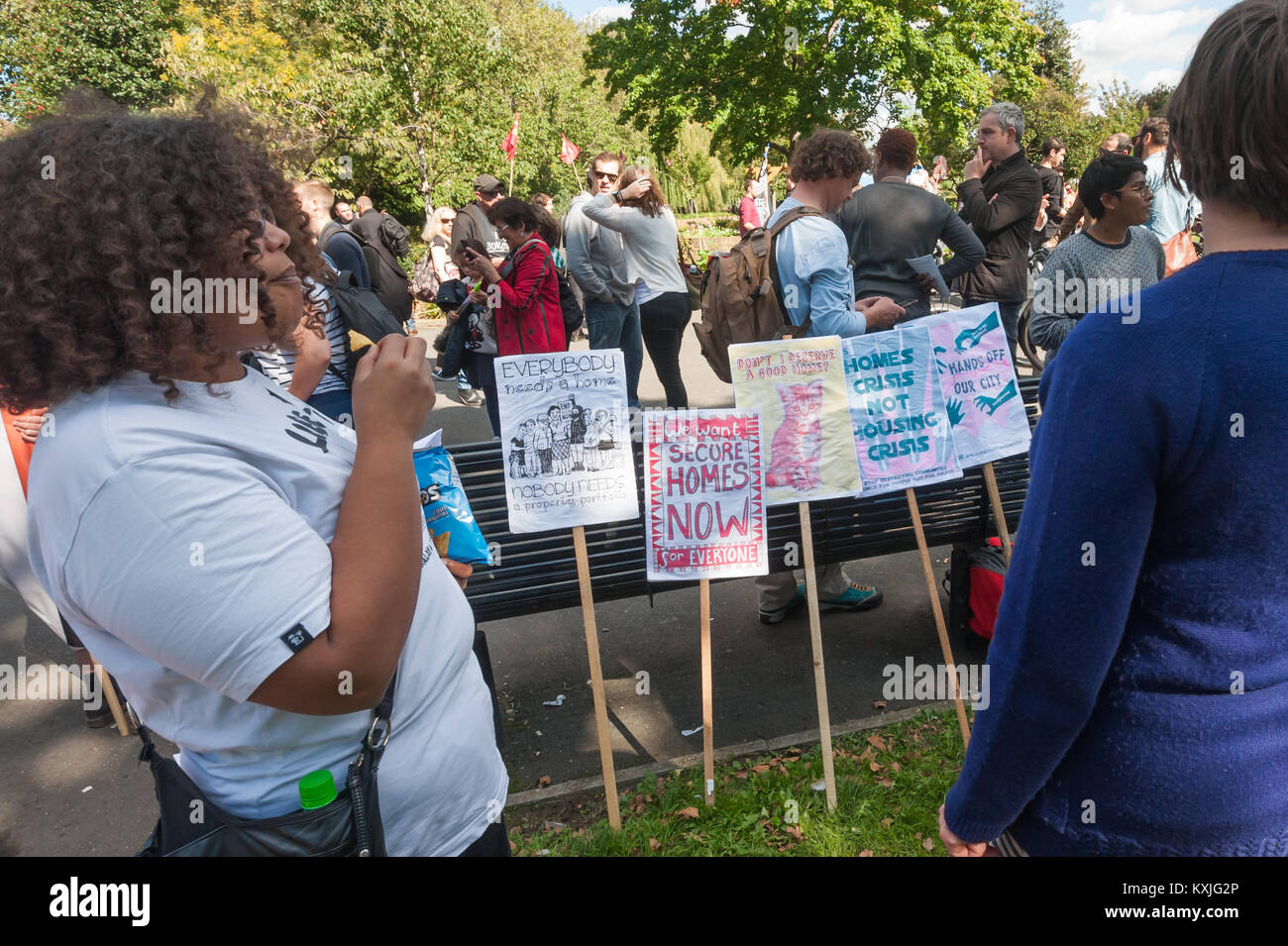 Some placards for the protest in a line include 'Everybody needs a home ...