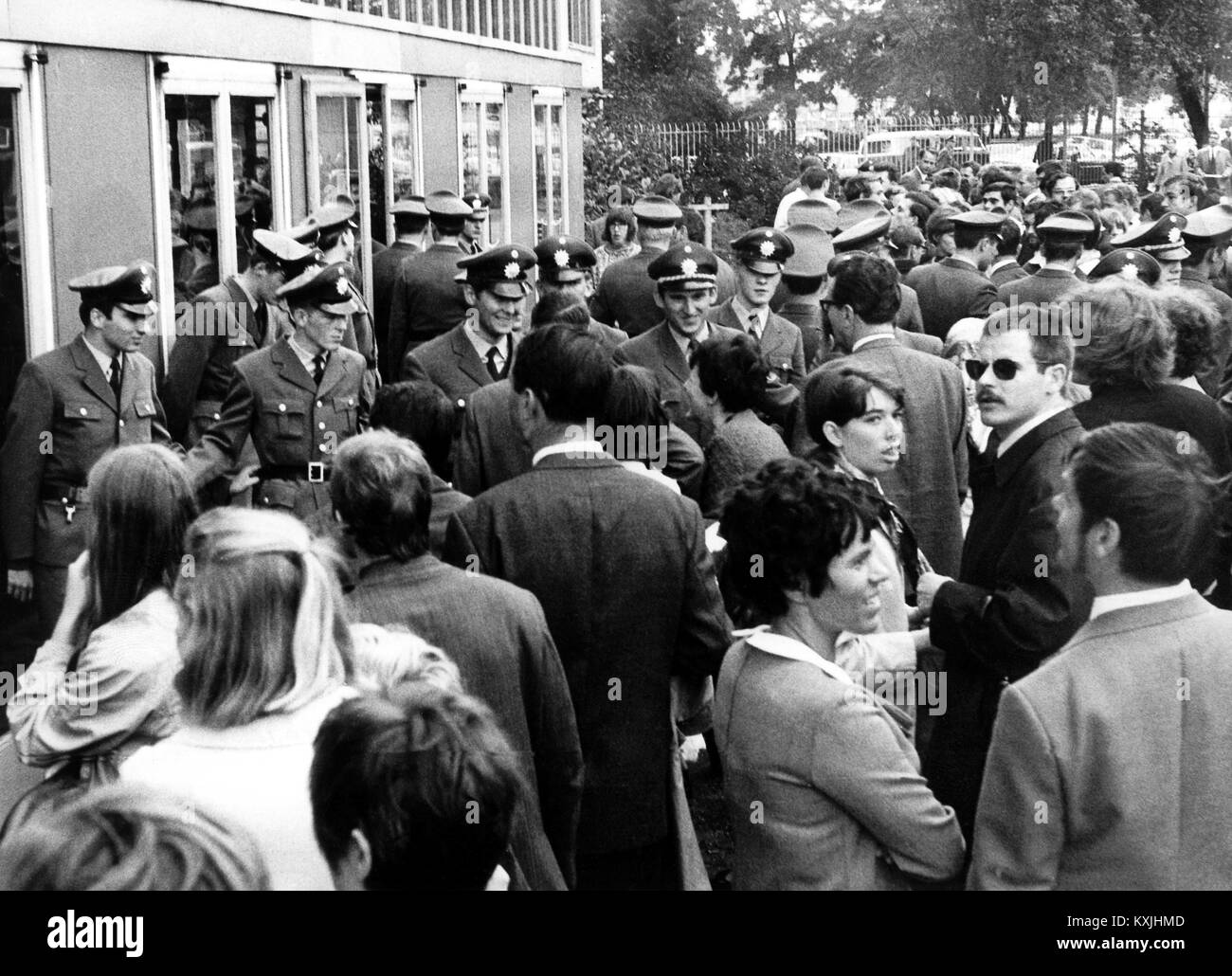 Police officers refuse to allow demonstrators to enter the exhibition ...