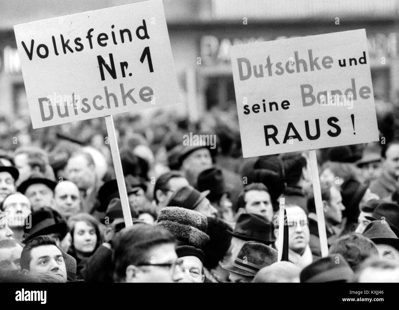 People of Berlin demonstrate with banners saying "Enemy of the people ...
