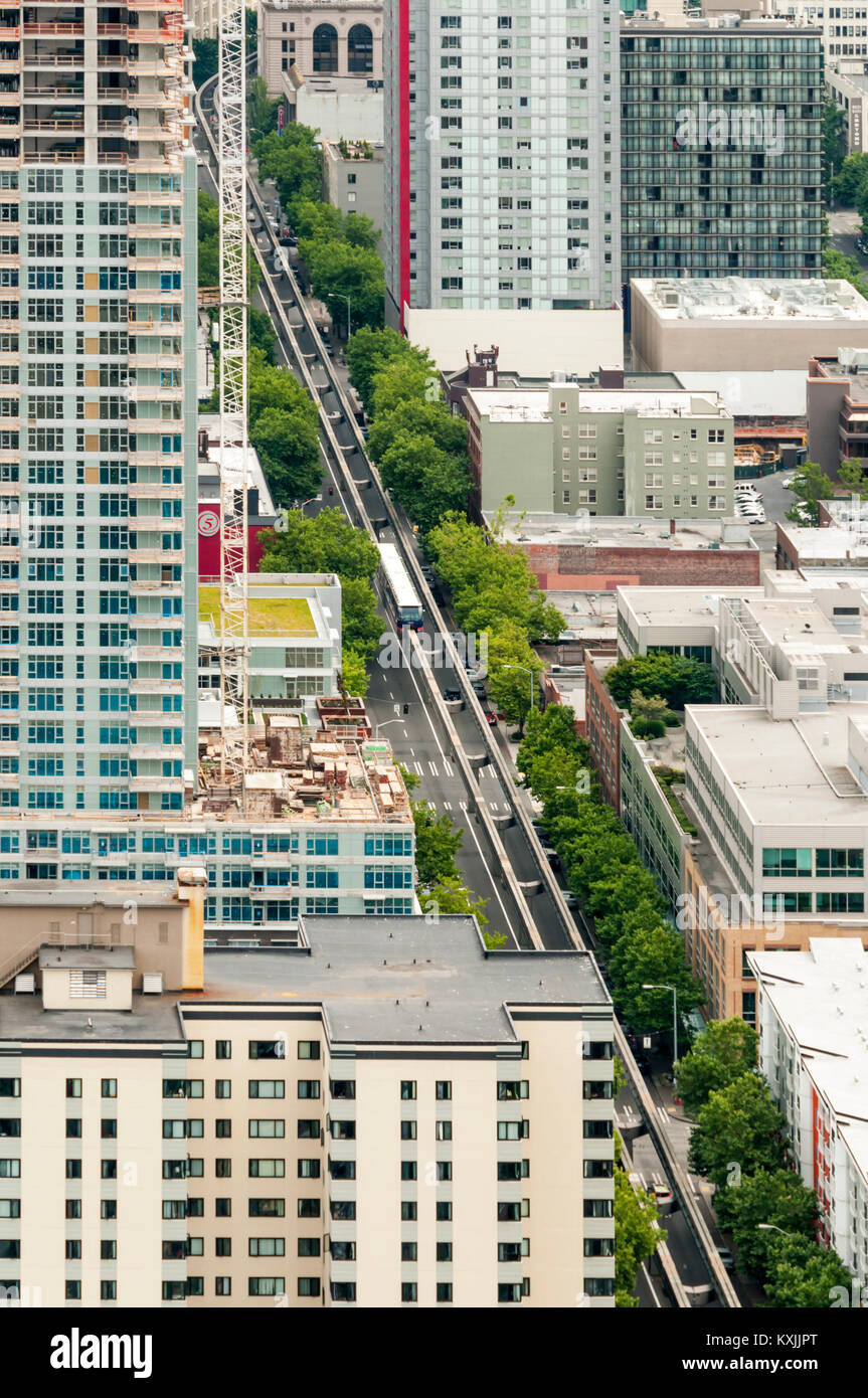 An elevated view of the Seattle Center Monorail seen travelling above ...