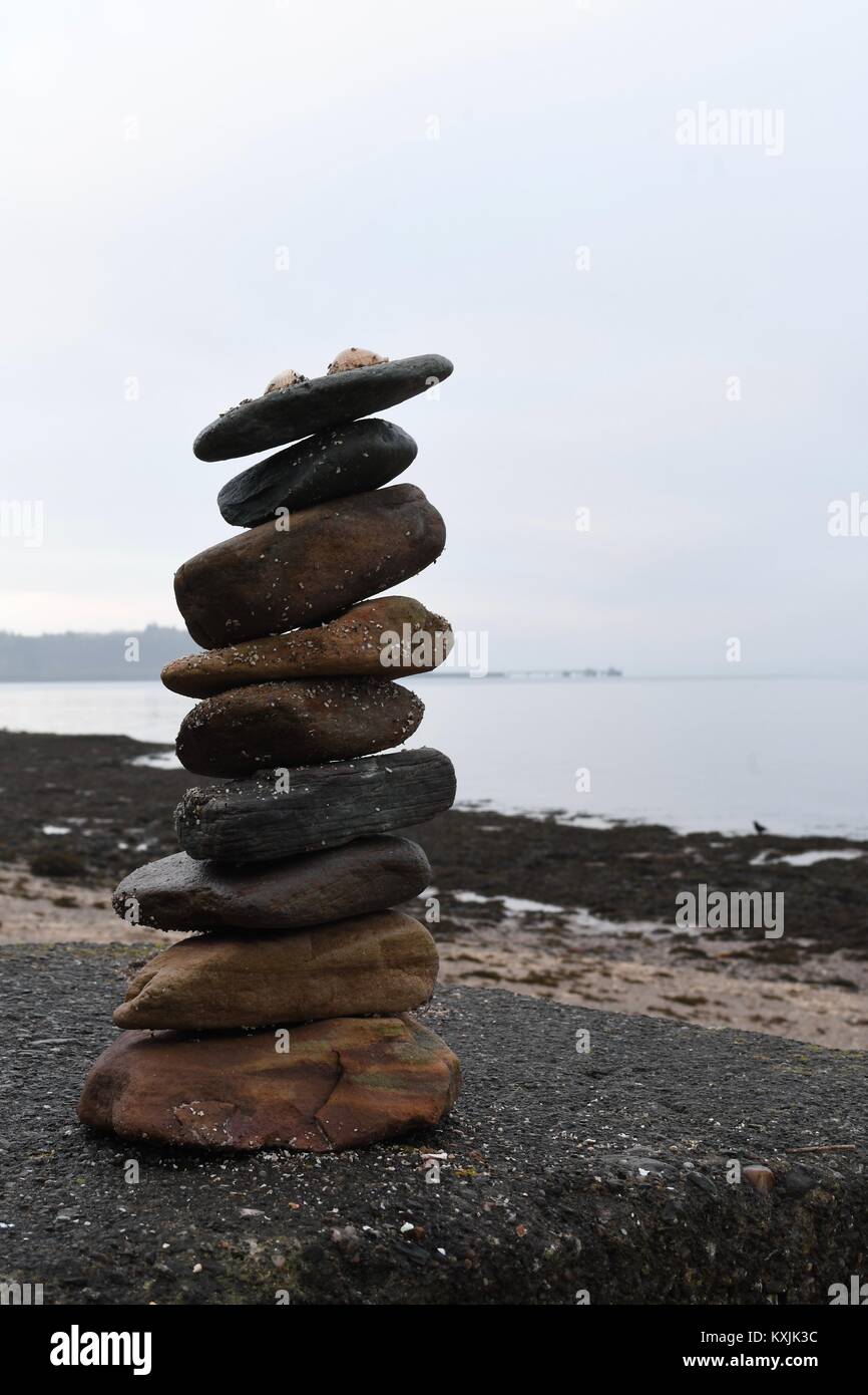 Stacked pebbles on Inverkip beach Stock Photo - Alamy
