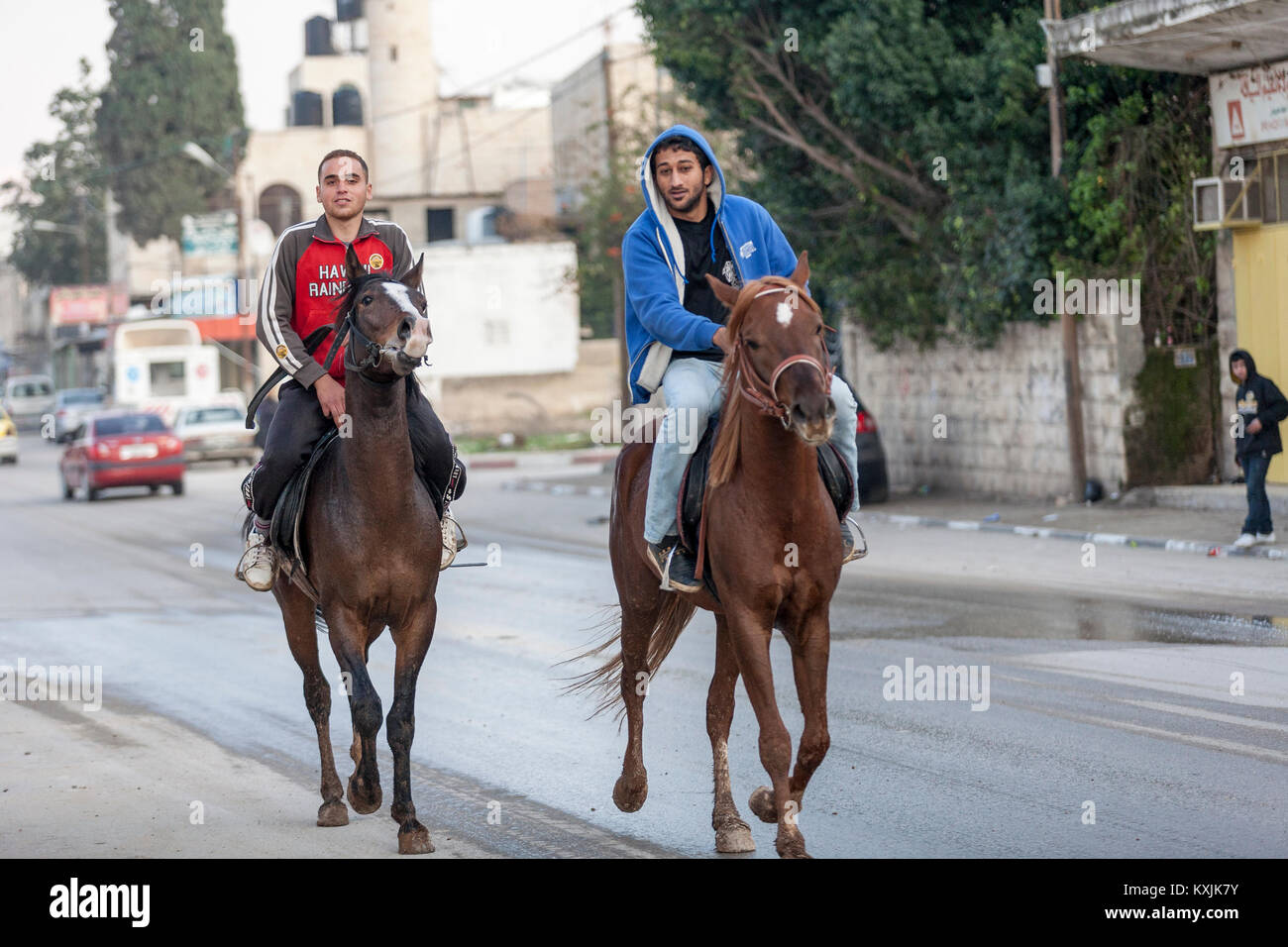 Jenin, Palestine, January 11, 2011: Palestinian young men in horsebacks ...