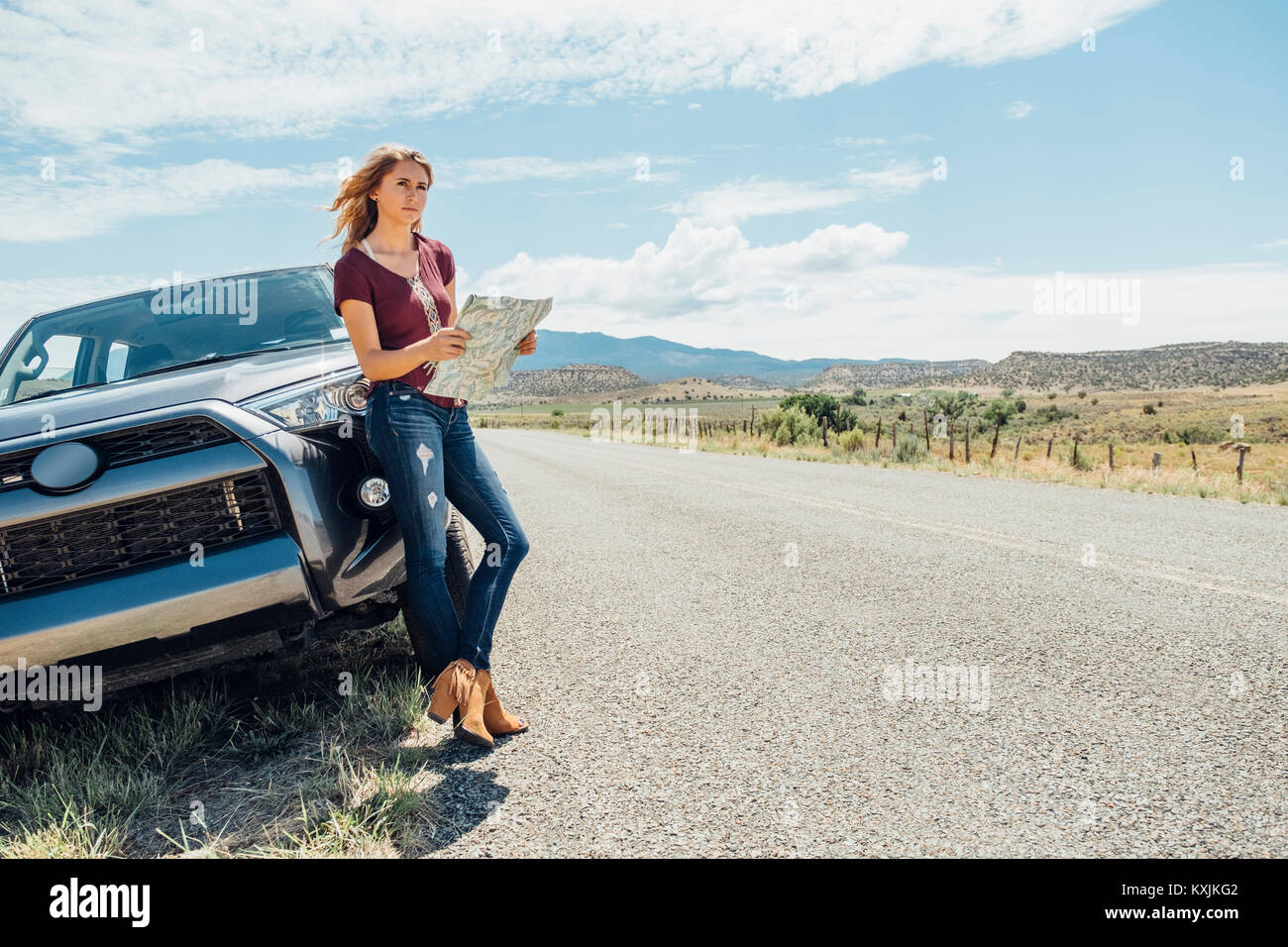 Woman getting car road hi-res stock photography and images - Alamy