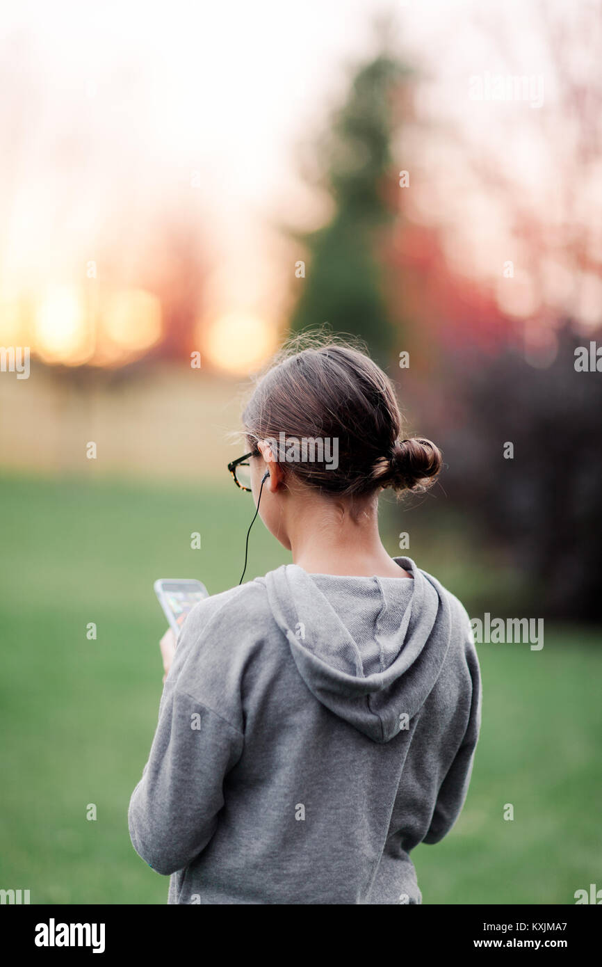 Girl wearing earphone,listening music hi-res stock photography and ...