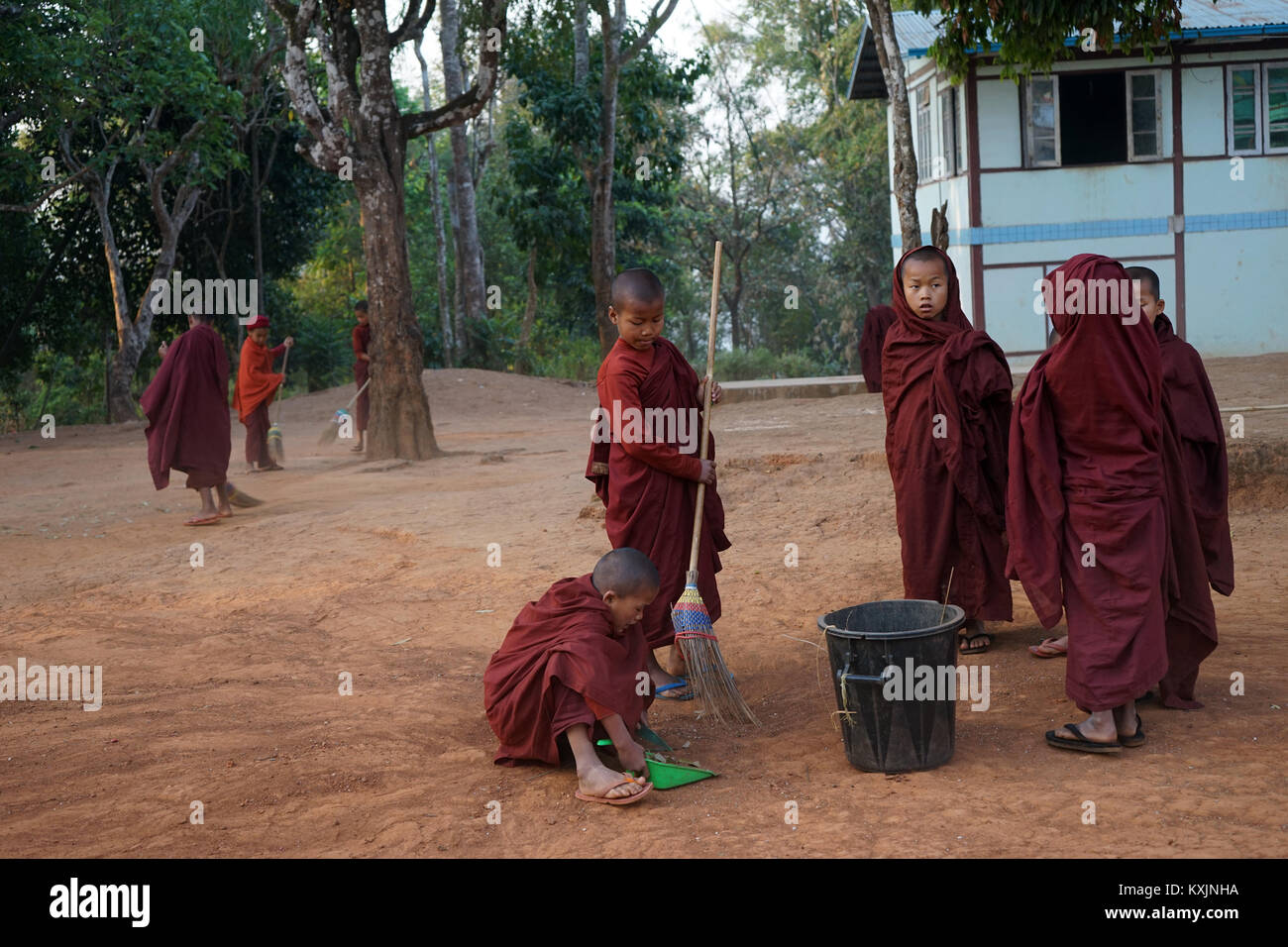 KALAW, MYANMAR - CIRCA APRIL 2017 Young monks sweep the yard Stock ...