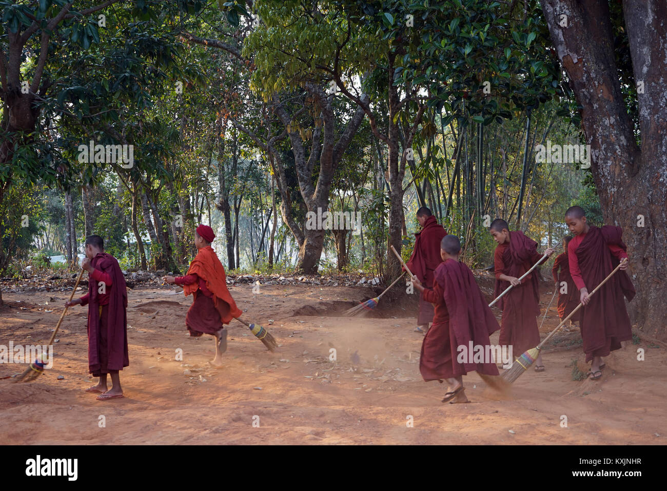KALAW, MYANMAR - CIRCA APRIL 2017 Young monks sweep the yard Stock ...