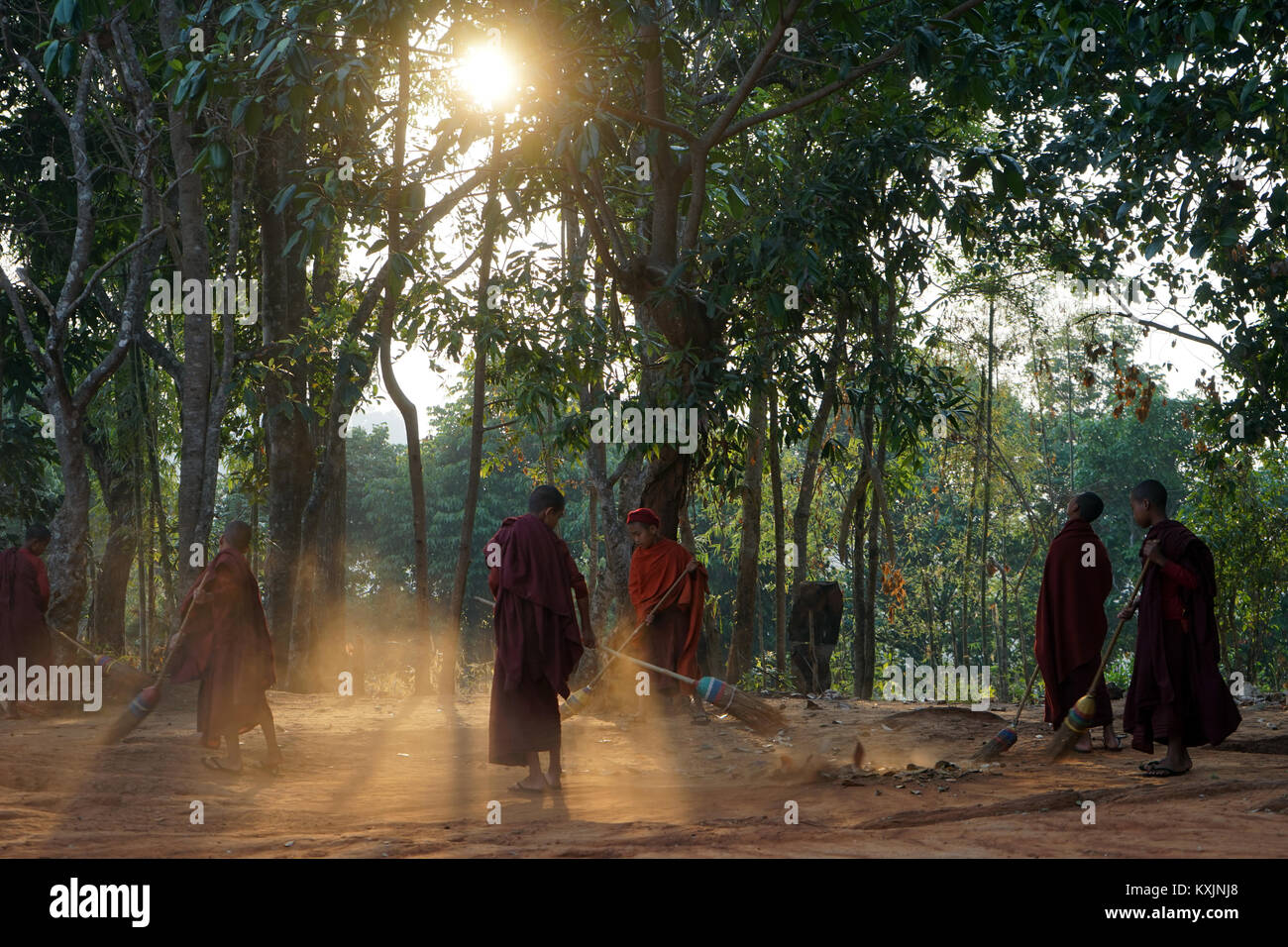 KALAW, MYANMAR - CIRCA APRIL 2017 Young monks clean the inner yard ...