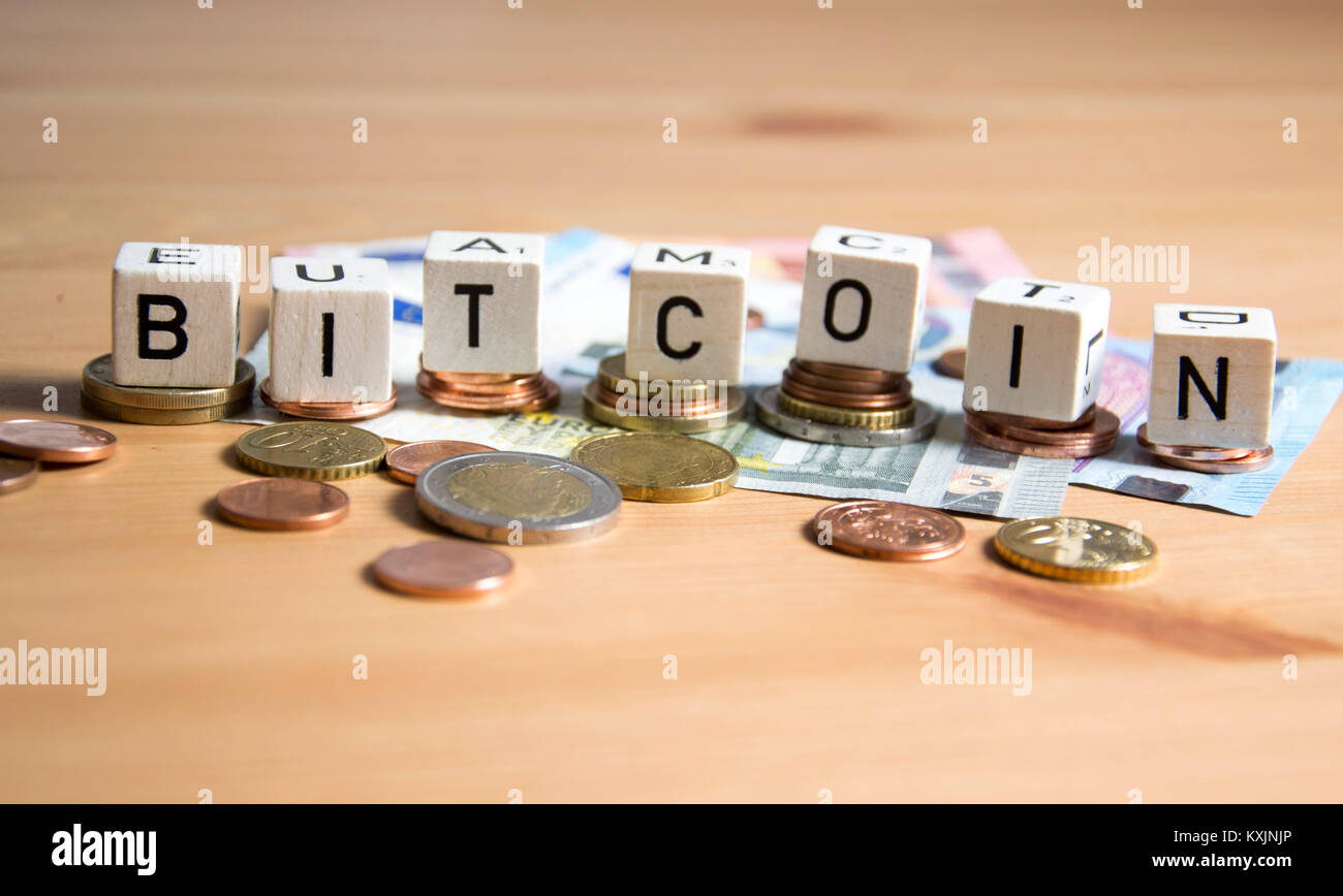 Bitcoin word written on wood cube Stock Photo - Alamy