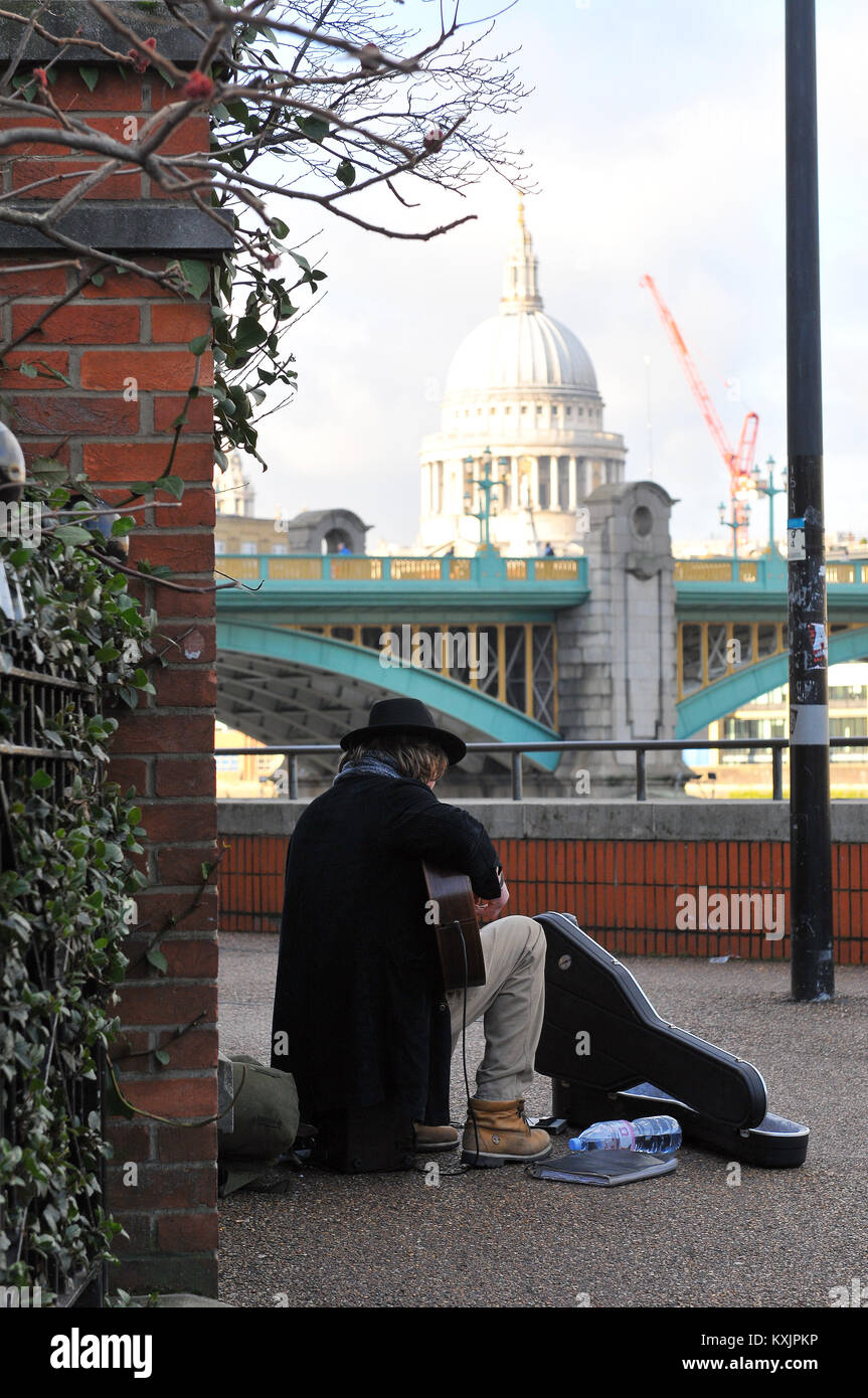 Busker on the south bank of the river thames hi-res stock photography ...