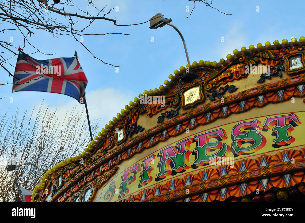 A fairground ride on a vintage carousel with old fashioned decoration ...