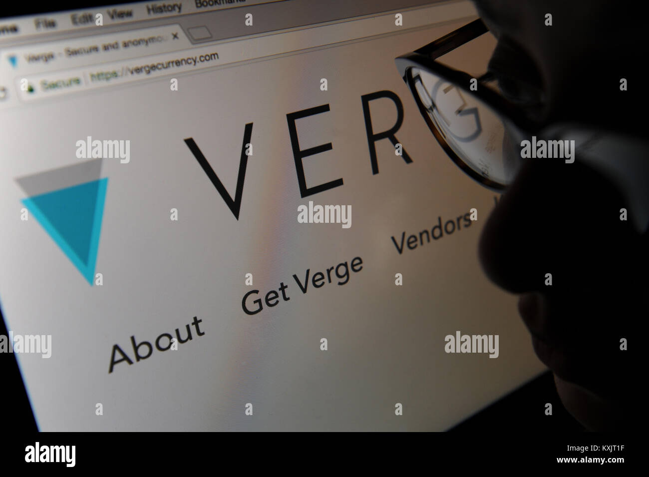 A woman looks at the Verve website, Verge is a cryptocurrency Stock ...