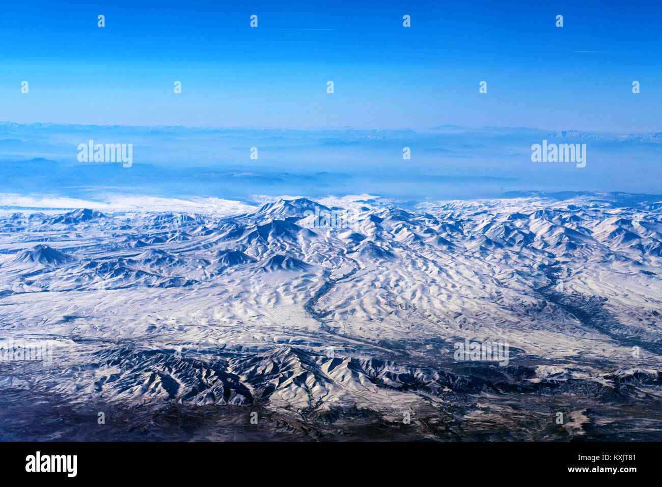 Aerial mountain view from aircraft Stock Photo - Alamy