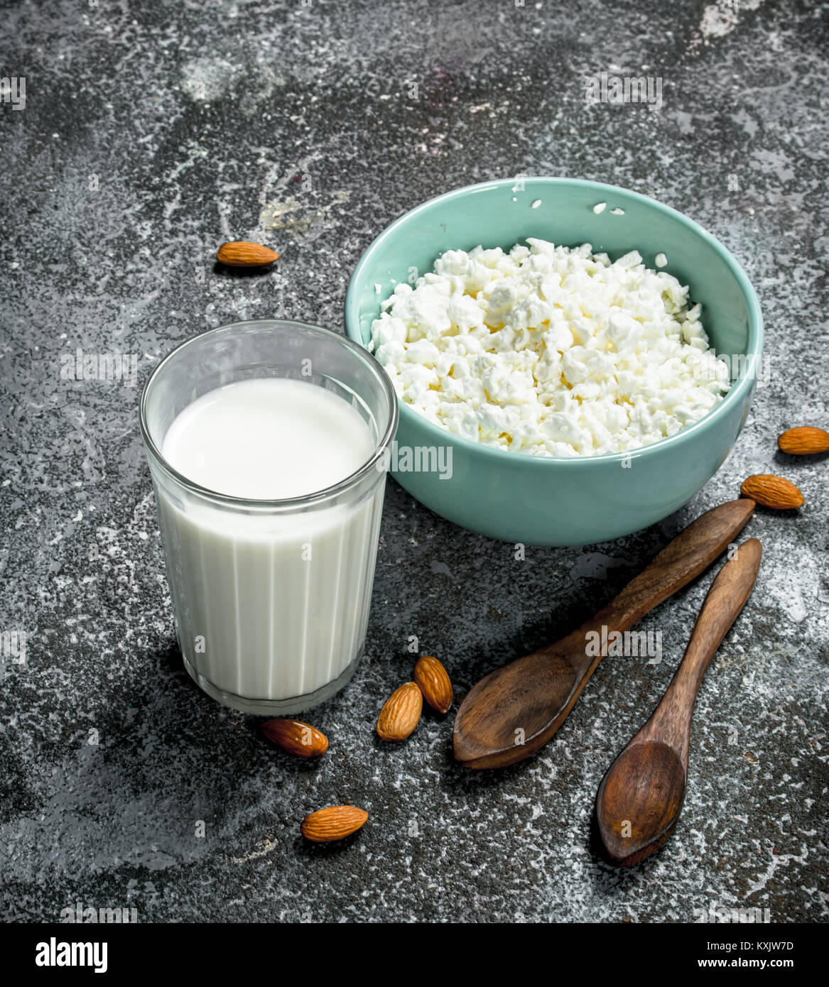 Cottage cheese and natural cow milk. On a rustic background Stock Photo ...