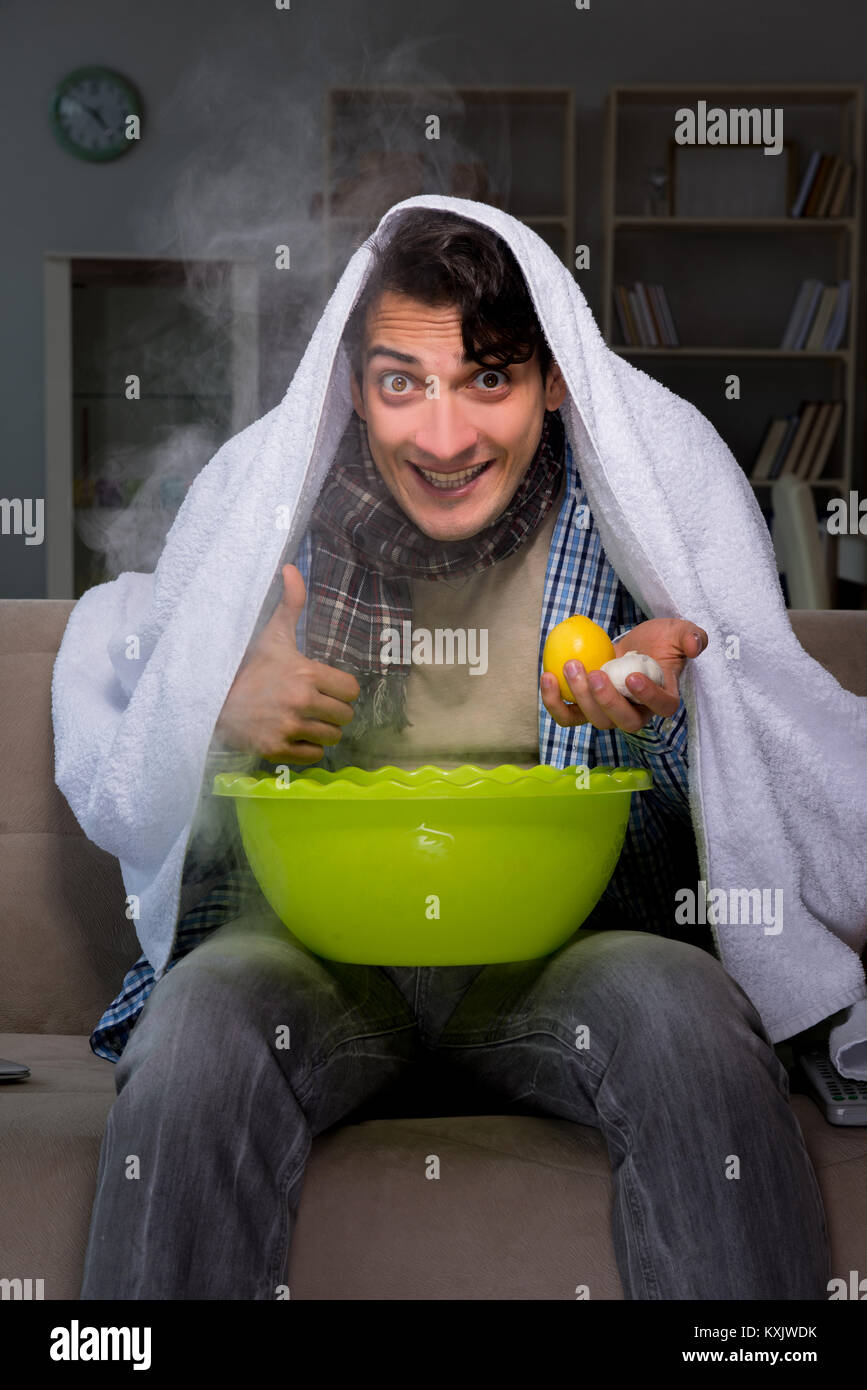Sick man doing inhalation at night in home Stock Photo - Alamy