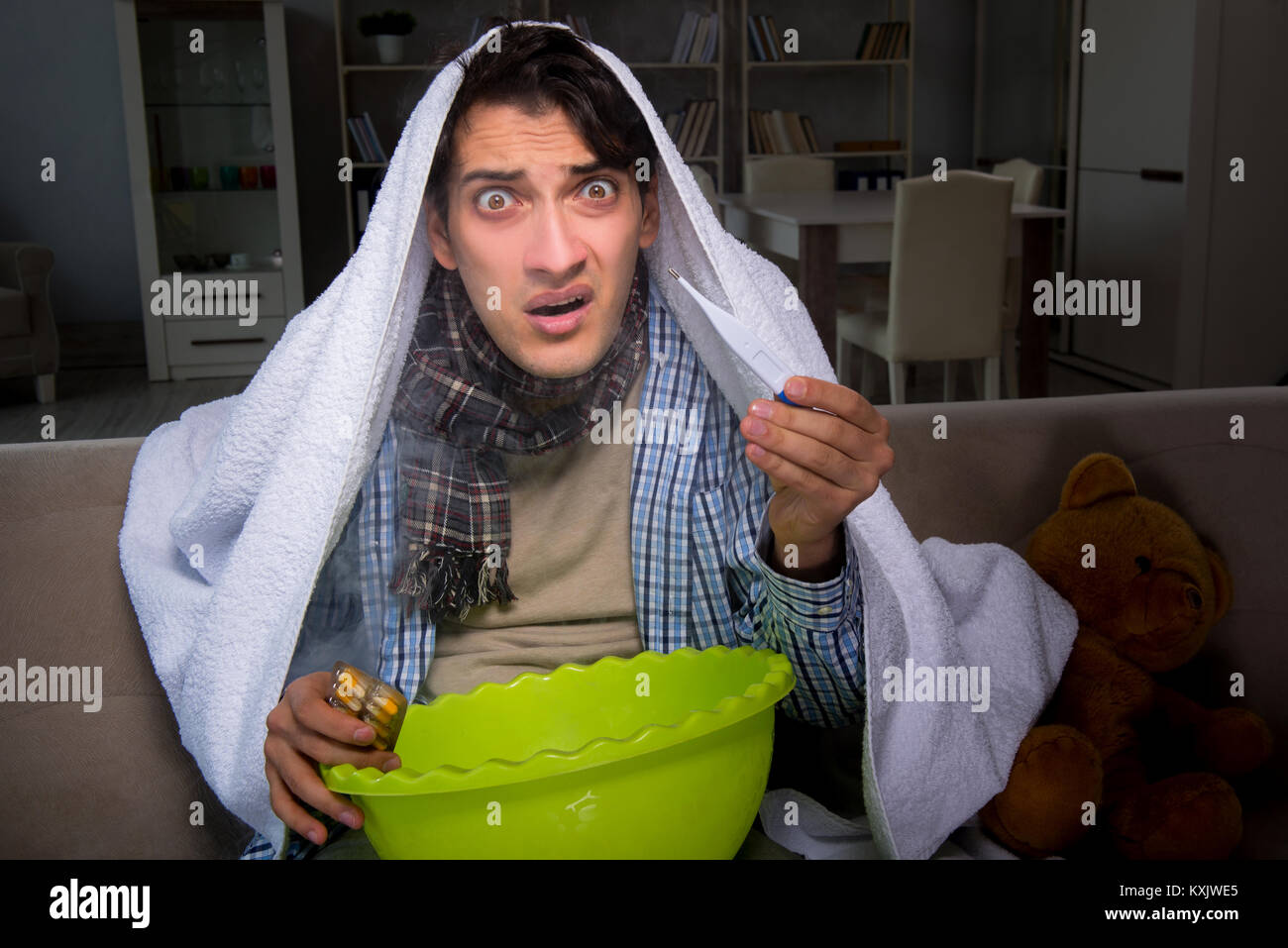 Sick man doing inhalation at night in home Stock Photo - Alamy